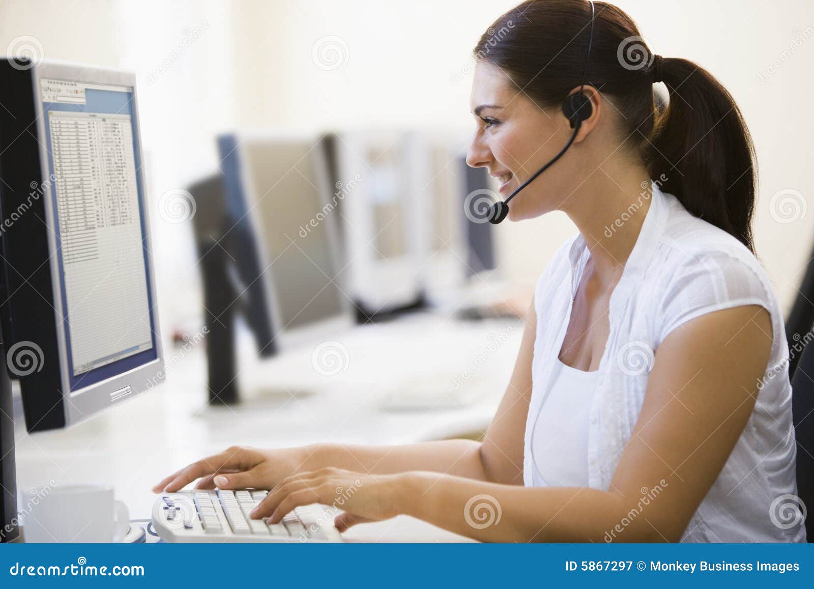 Woman Wearing Headset in Computer Room Smiling Stock Image - Image of ...