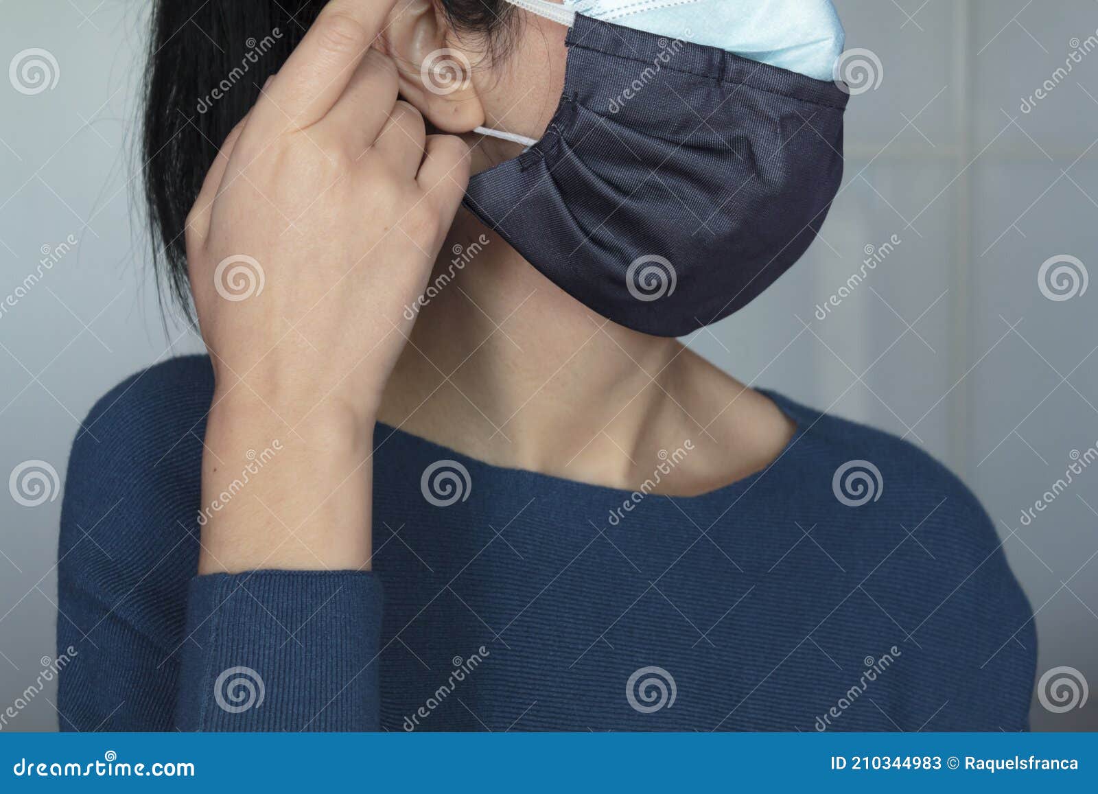 Woman Using Two Face Masks at the Same Time Stock Image - Image of ...