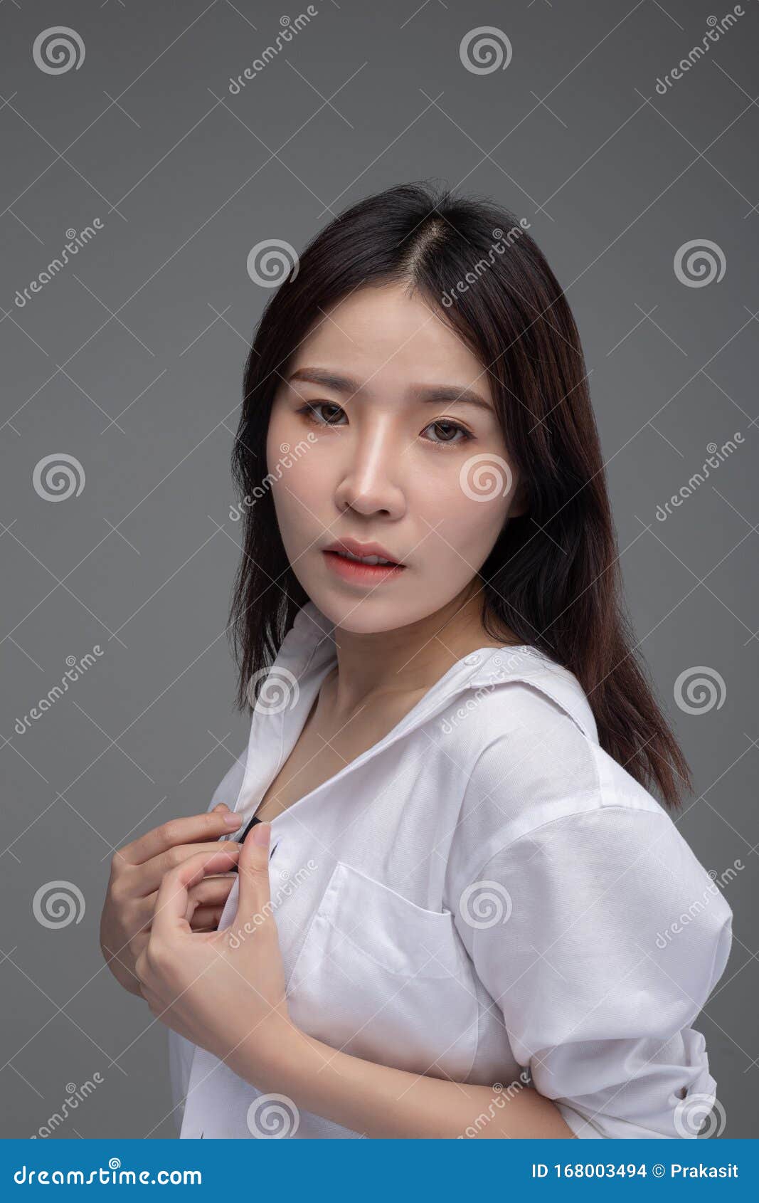 The Woman is Wearing a White Shirt and Facing the Left Hand Side Stock ...