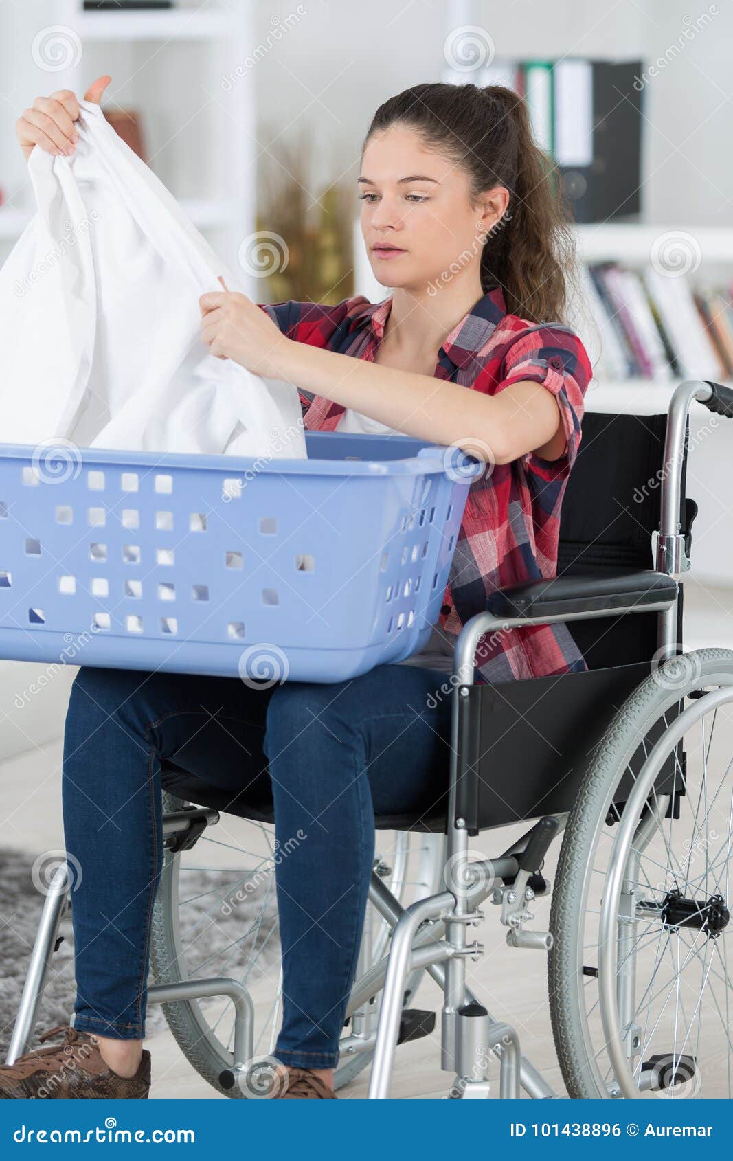 Woman in Wheelchair Doing Laundry Stock Photo - Image of routine ...