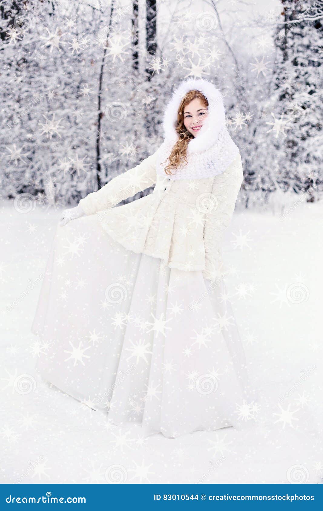 Woman In White Snow Suit Standing On A Snow Covered Ground Behind A ...