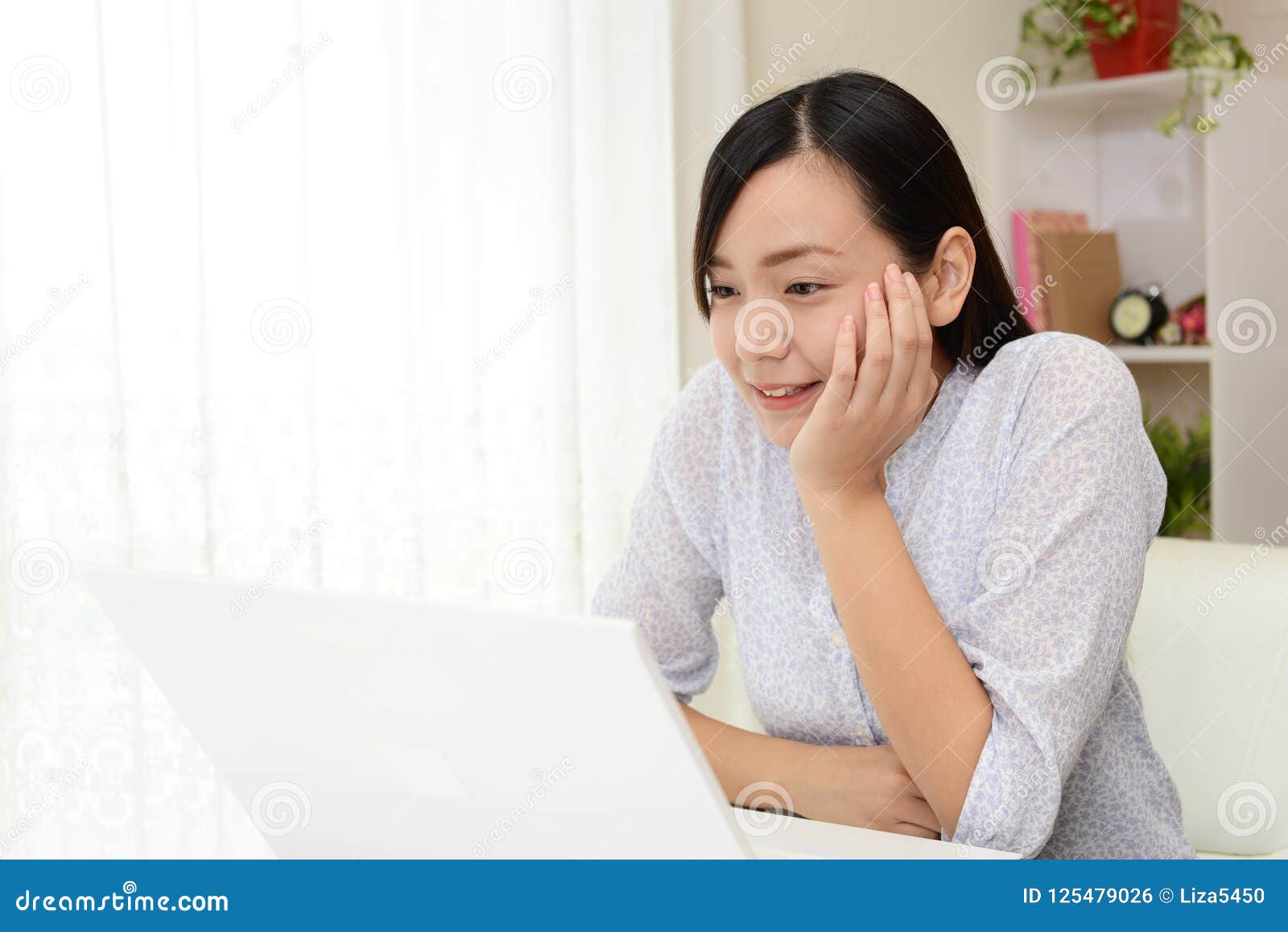 Smiling Woman Using a Laptop Stock Photo - Image of female, attractive ...