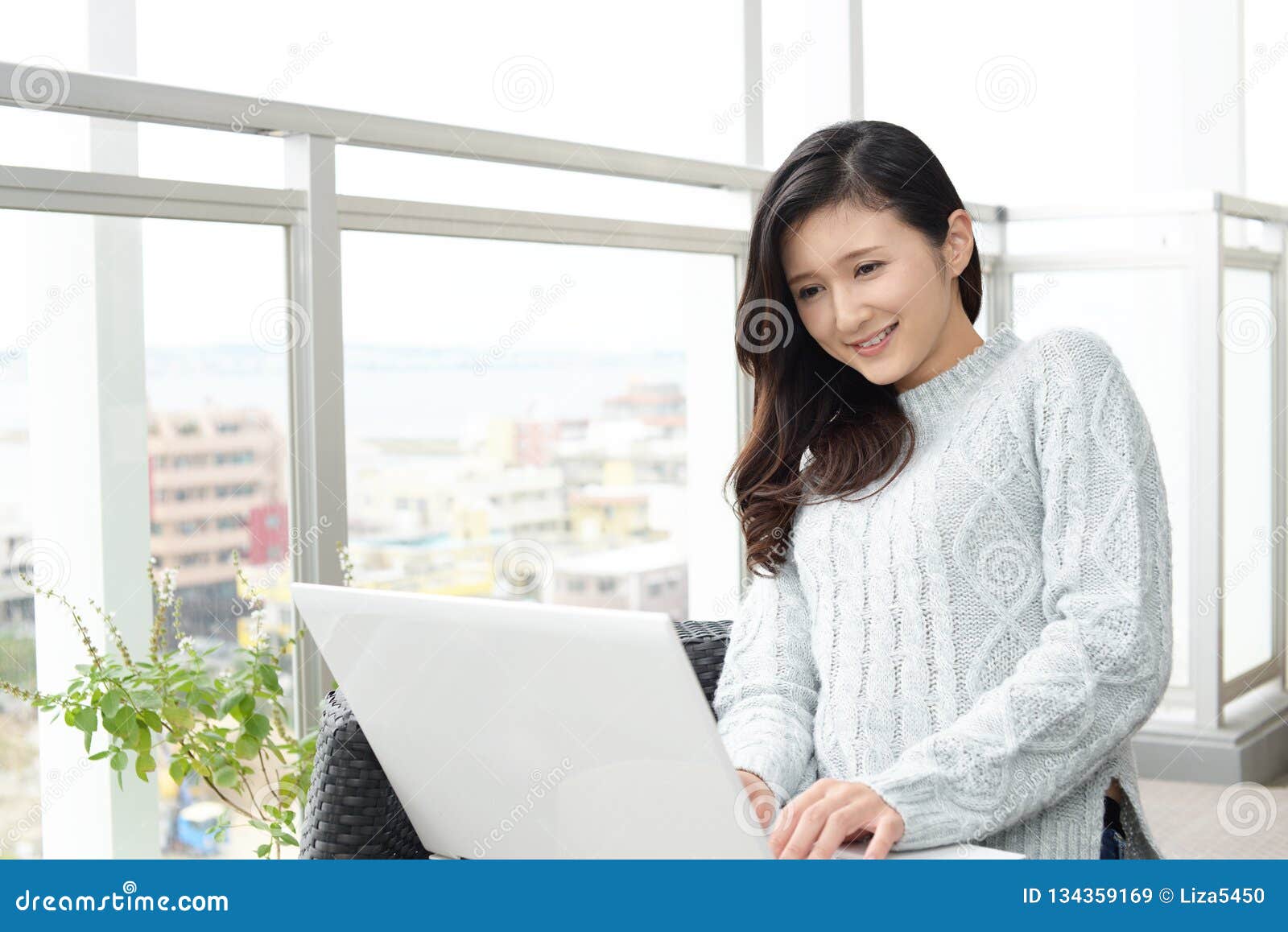 Smiling Woman Using a Laptop Stock Image - Image of happy, face: 134359169