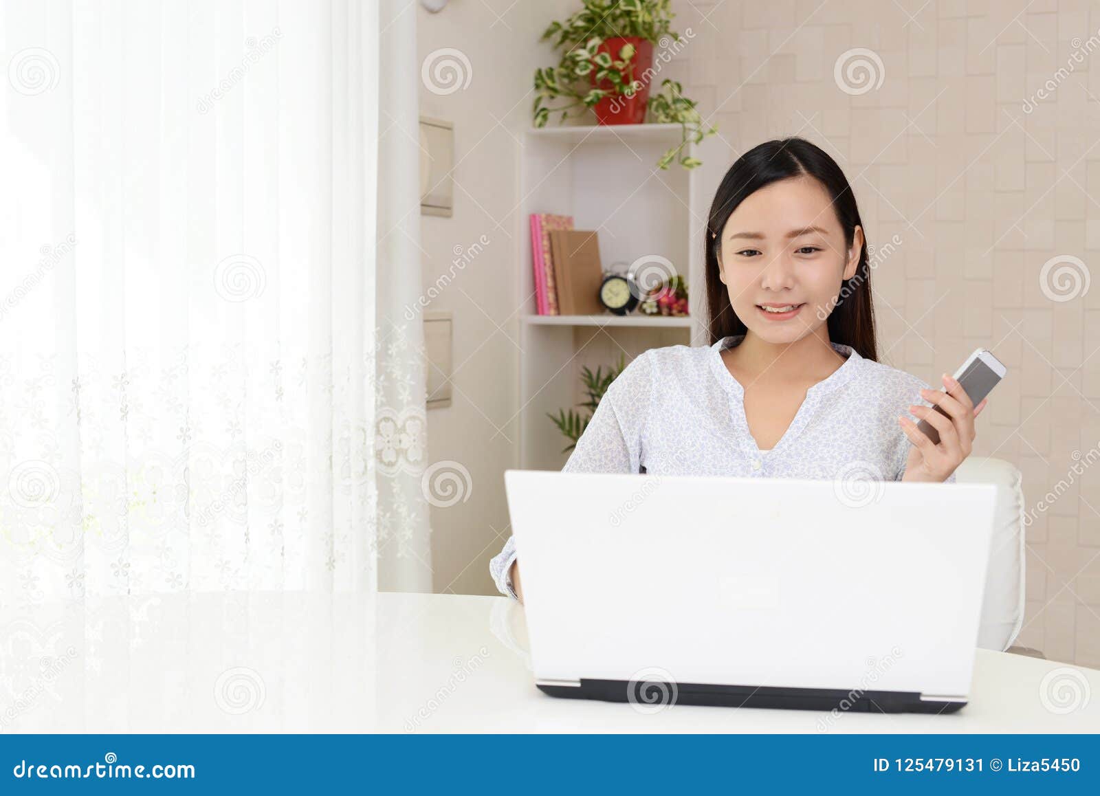 Woman using a laptop stock image. Image of camera, female - 125479131