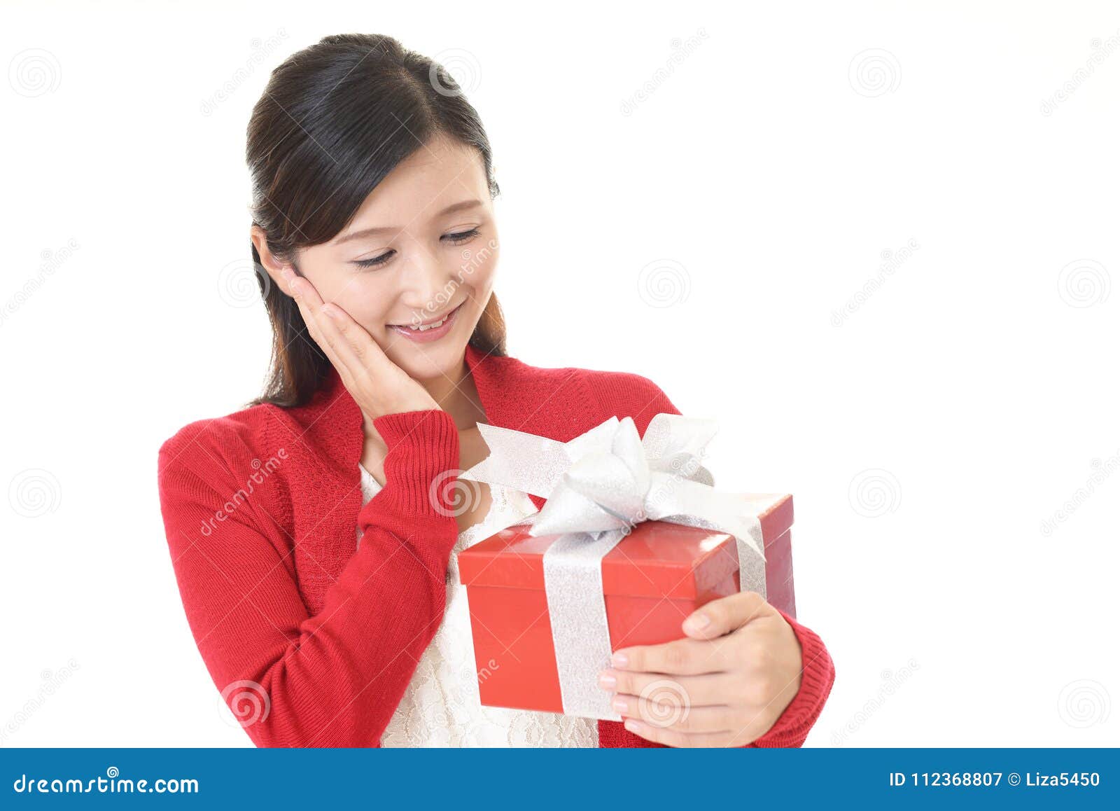 Smiling woman with a gift stock image. Image of elegant - 112368807