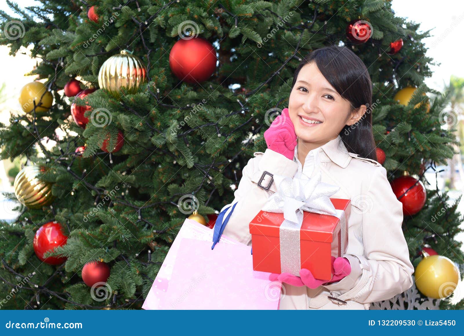 Smiling woman with a gift stock photo. Image of health - 132209530