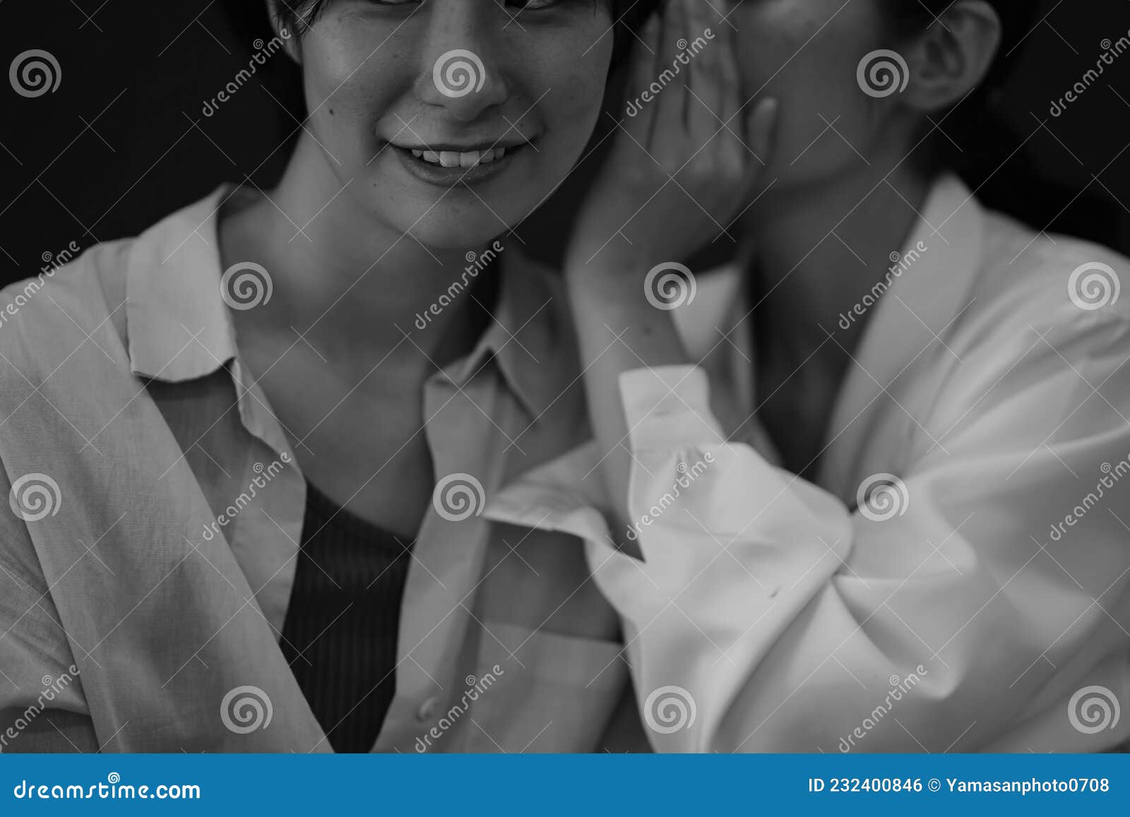 A woman who talks secretly stock photo. Image of indoors - 232400846