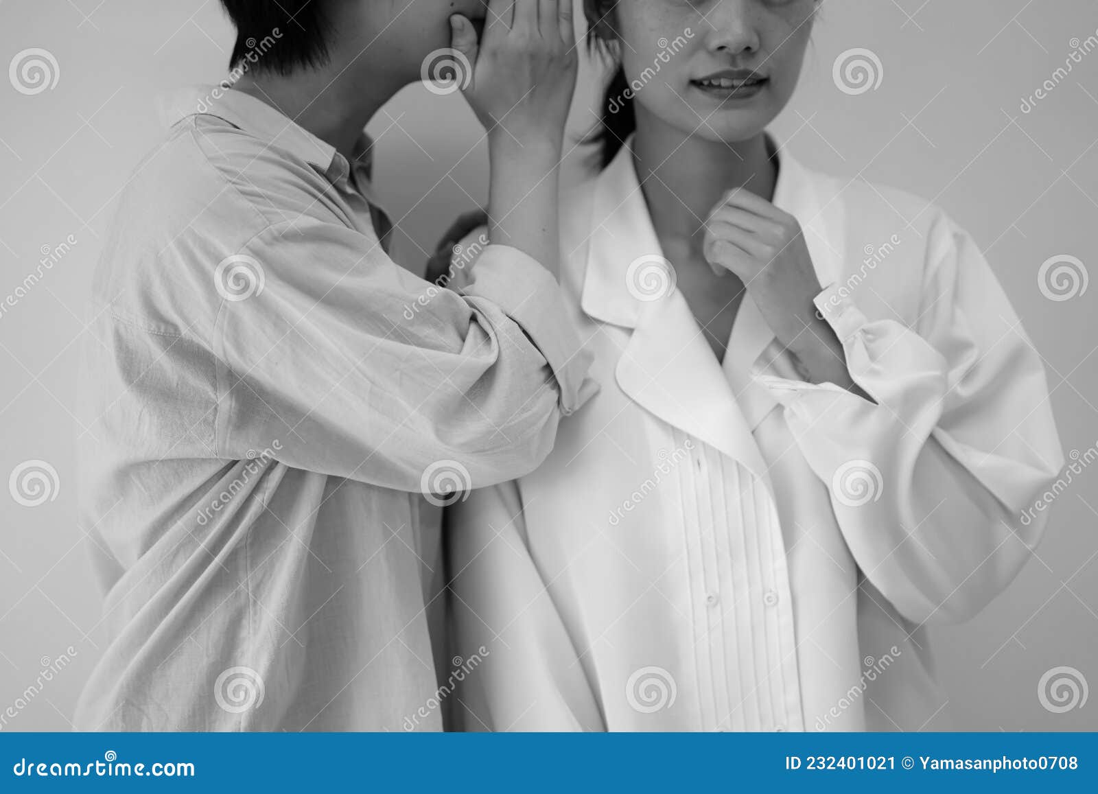 A woman who talks secretly stock image. Image of person - 232401021