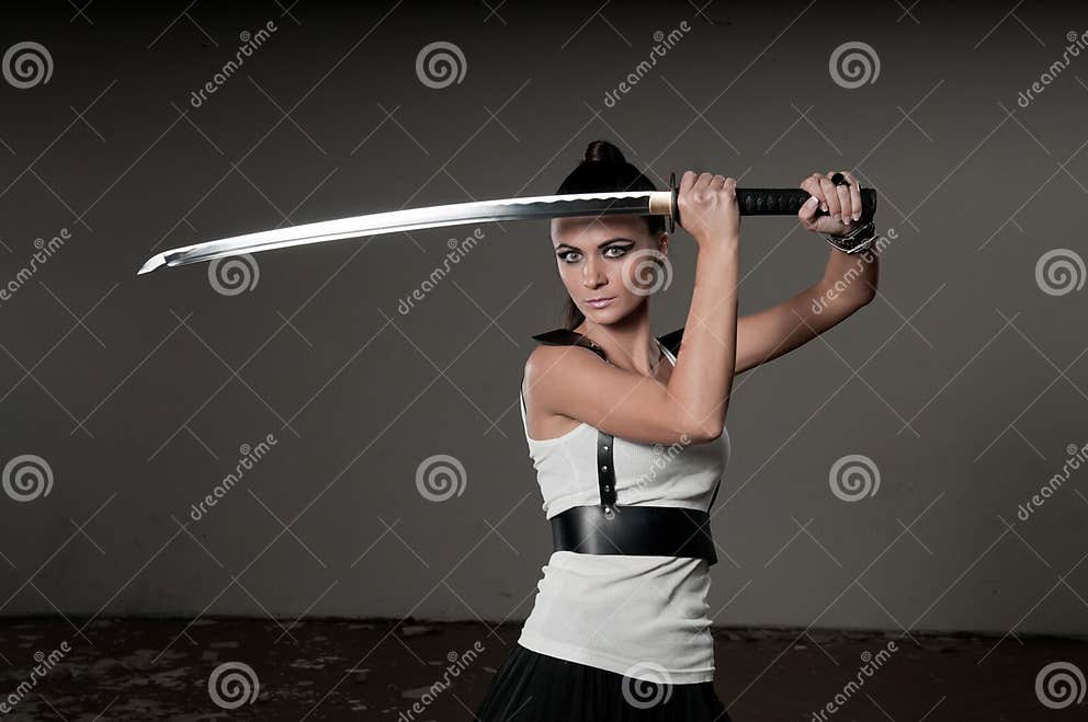 Woman Wielding Ceremonial Sword Stock Image - Image of confident, grey ...