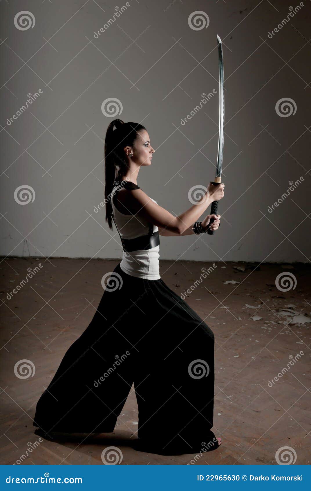 Woman Wielding katana stock photo. Image of striking - 22965630
