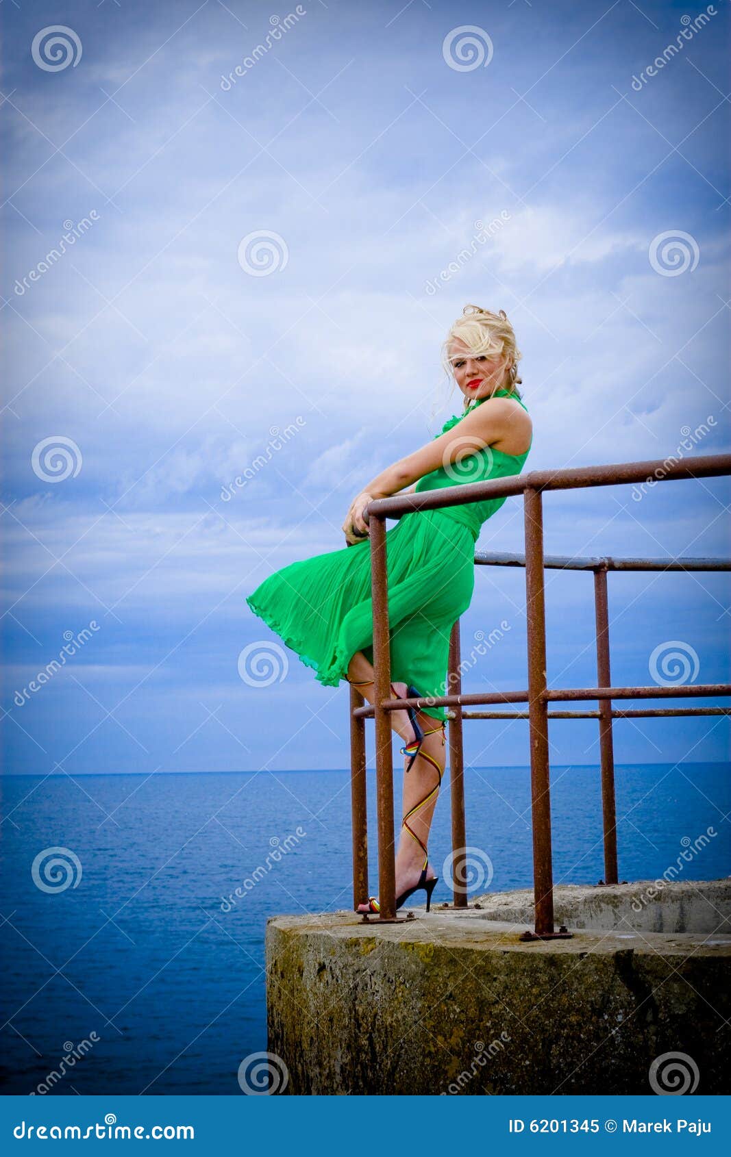 Woman at windy seaside stock image. Image of model, green - 6201345