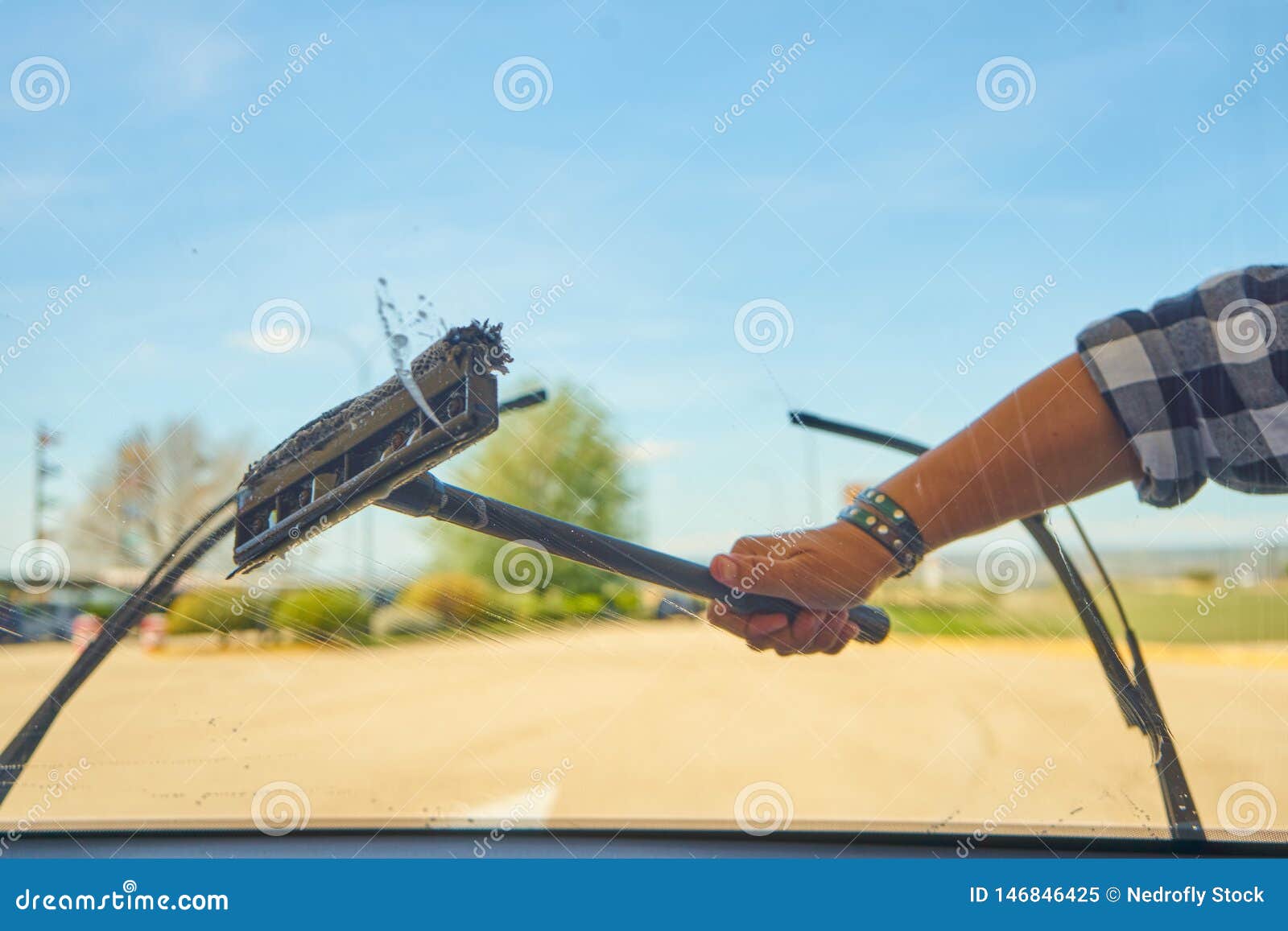 Woman Wiping Car Windshield with Squeegee Outdoors Stock Image - Image ...