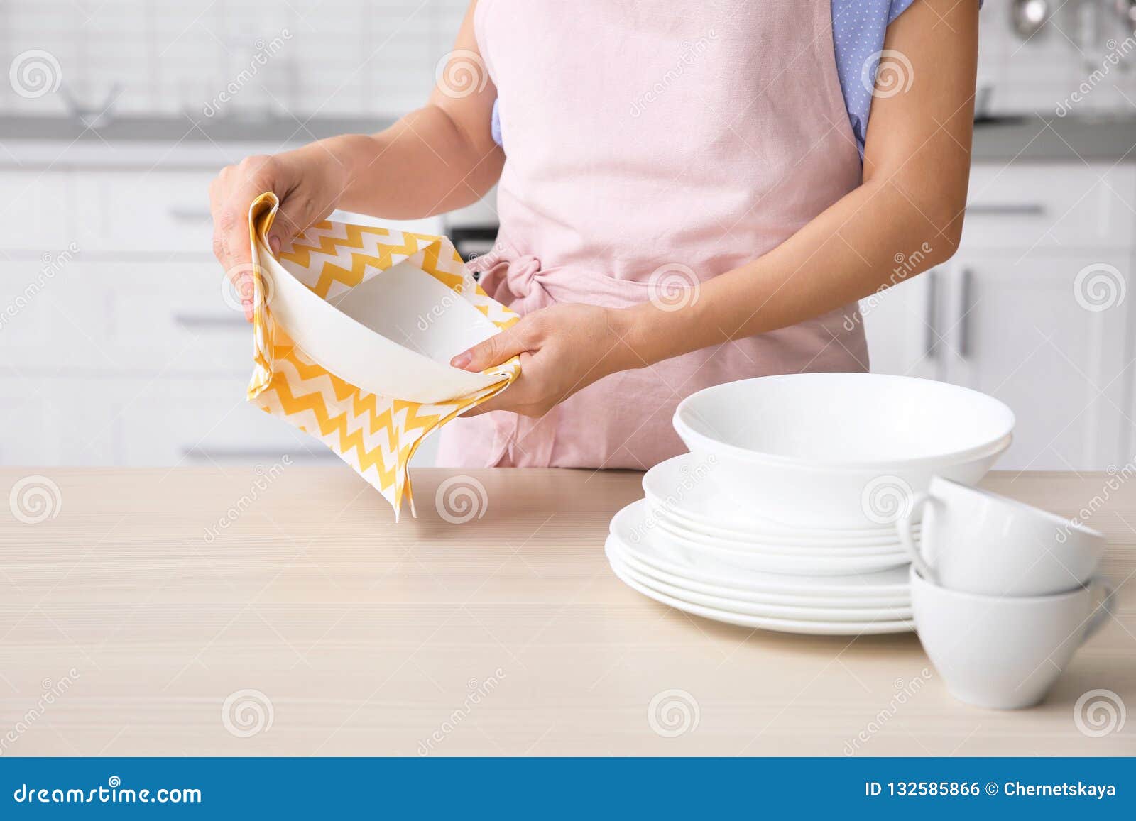 Woman Wiping Clean Dish at Table in Kitchen Stock Photo - Image of ...