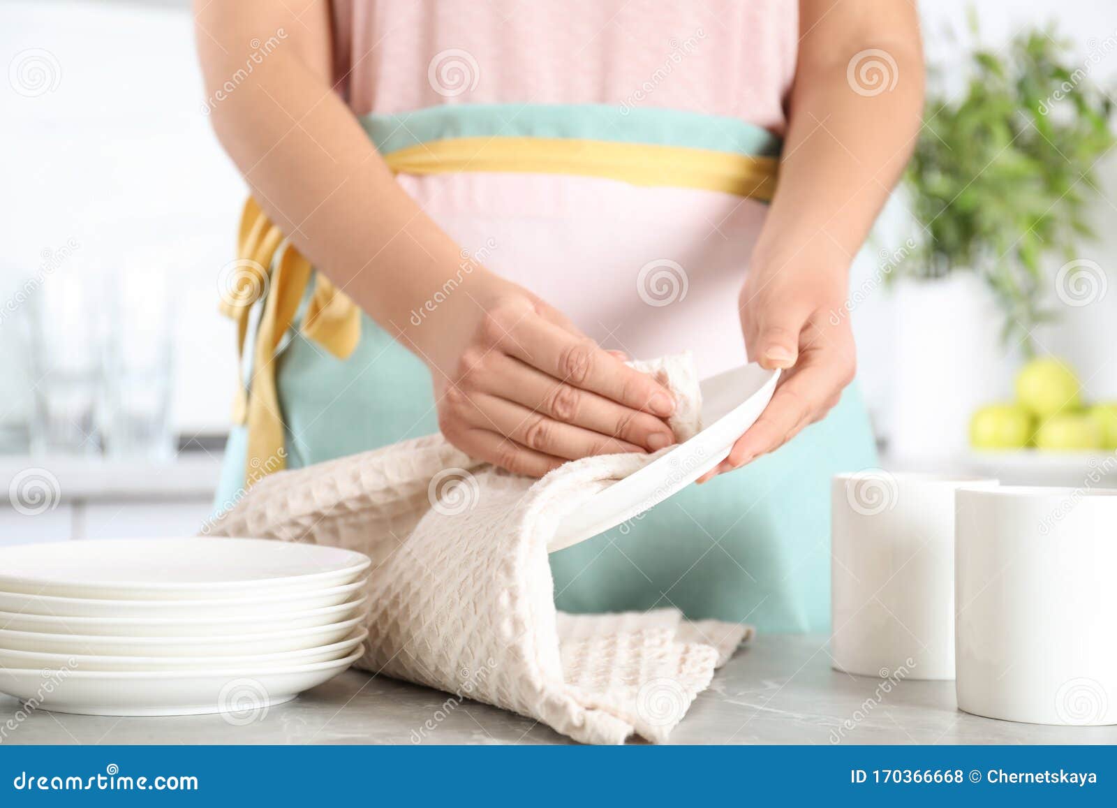 Woman Wiping Clean Plate at Table Stock Photo - Image of dinner, group ...