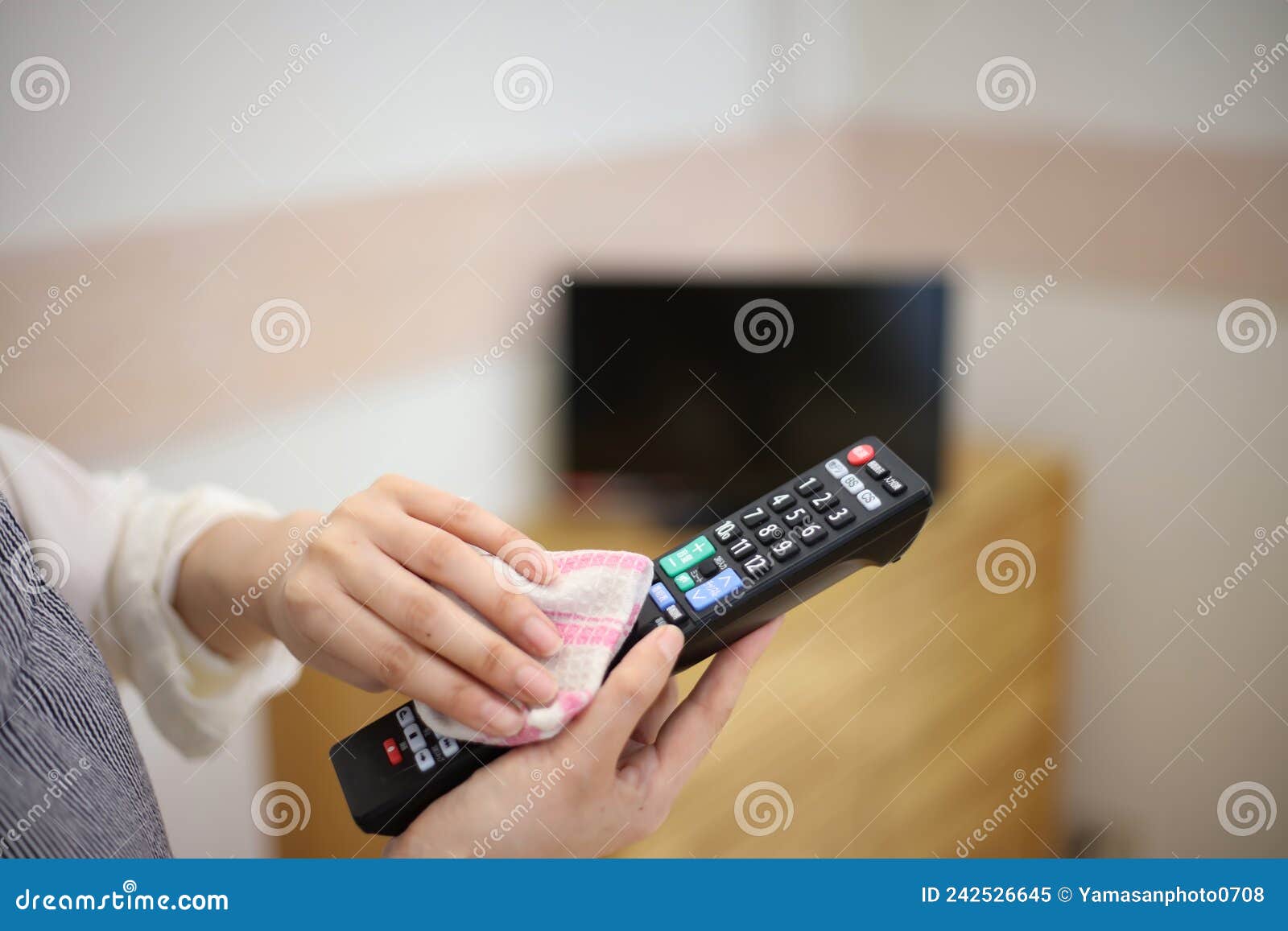 Woman Wiping the Remote Control Stock Image - Image of bright, smile ...