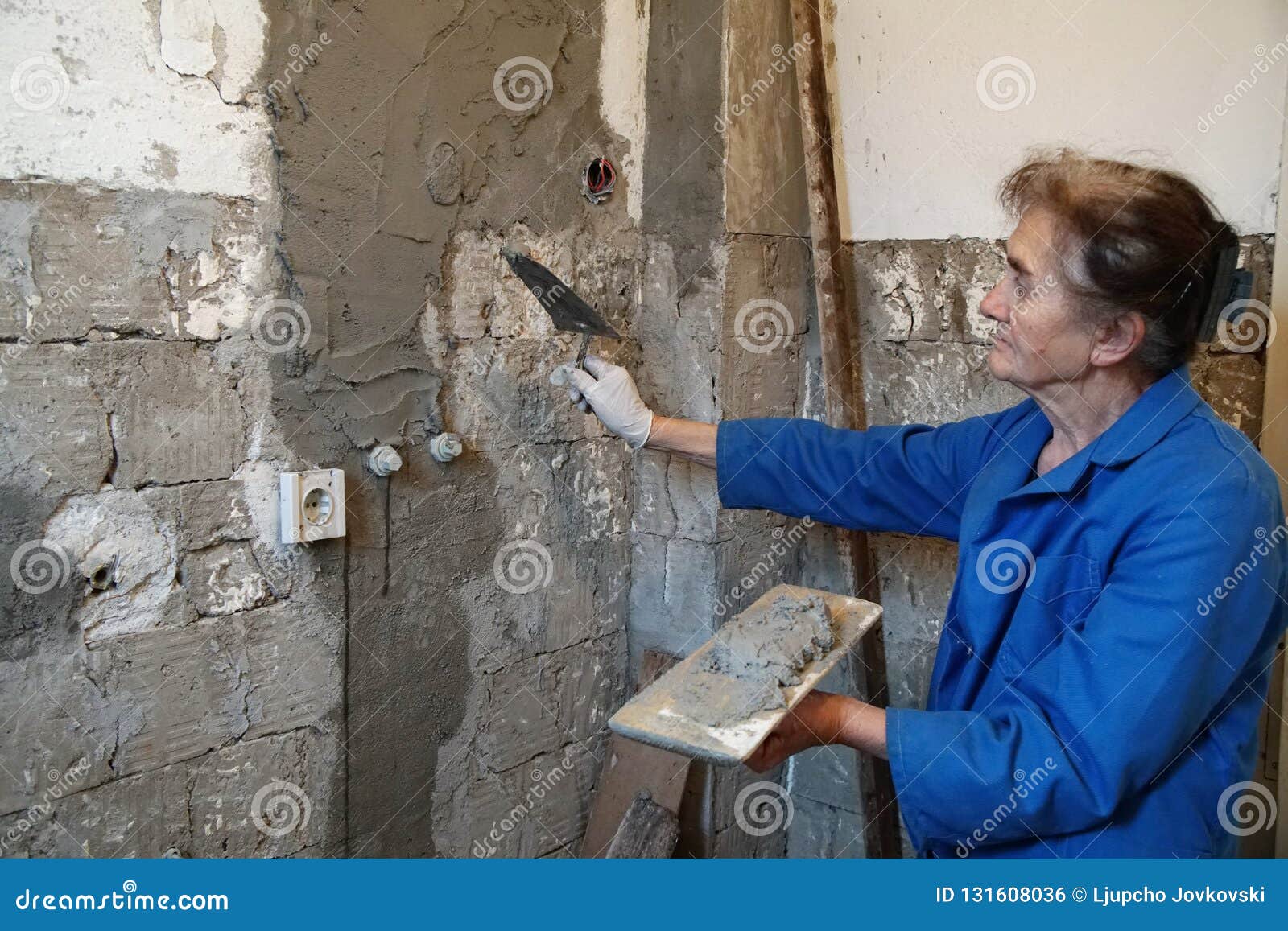 Woman Worker Plastering Concrete at Wall of House Stock Photo - Image ...