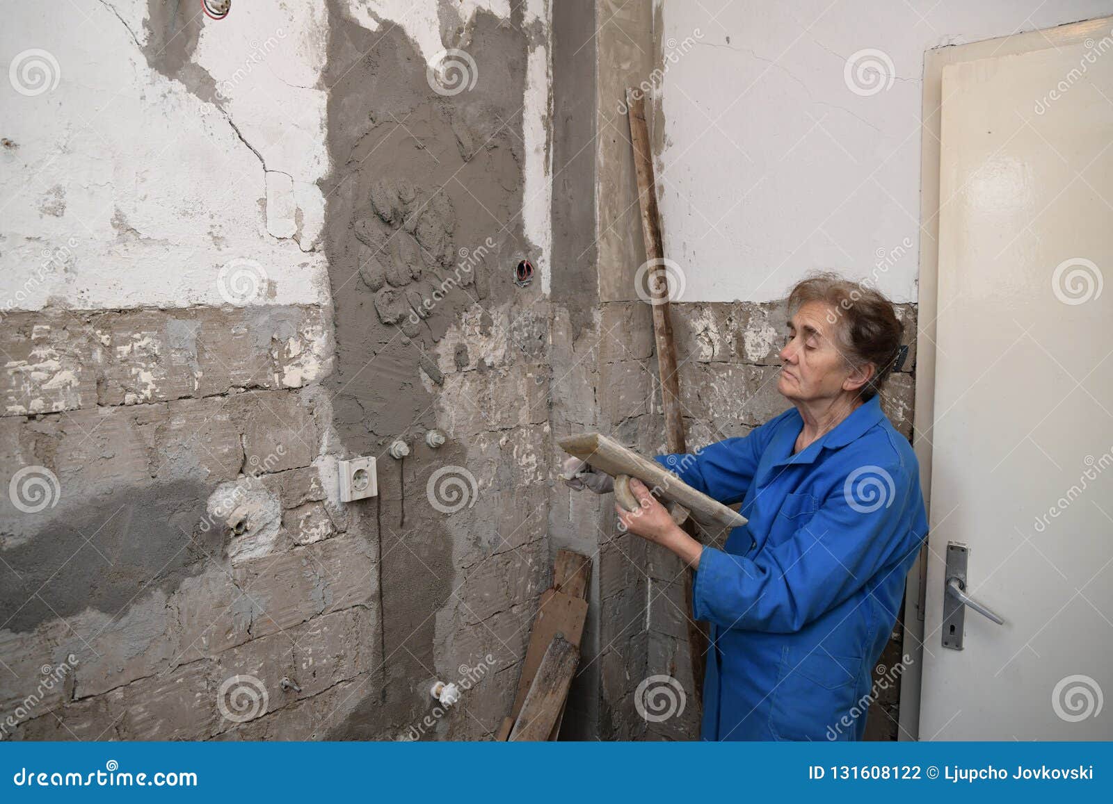 Woman Worker Plastering Concrete at Wall of House Stock Photo - Image ...