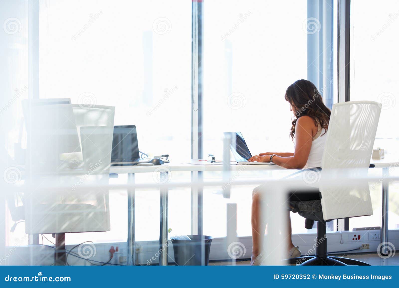 Woman Working Alone in an Office Stock Photo - Image of white ...