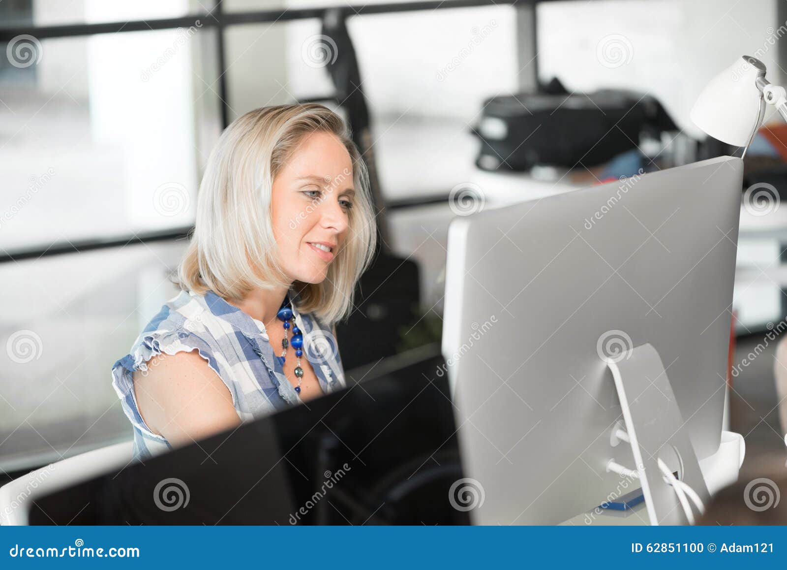 Woman working on computer stock photo. Image of editor - 62851100