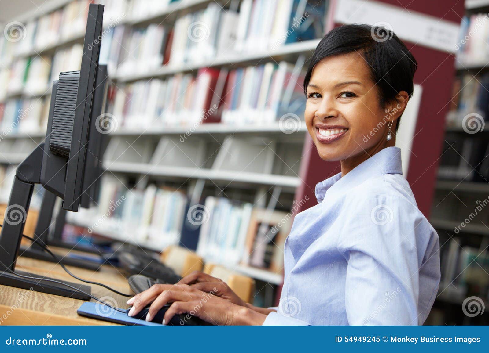 Woman Working on Computer in Library Stock Image - Image of information ...
