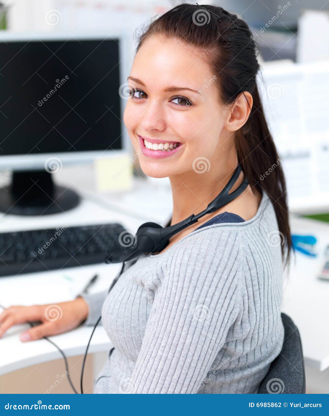 Woman Working on Computer and Looking Behind Stock Photo - Image of ...