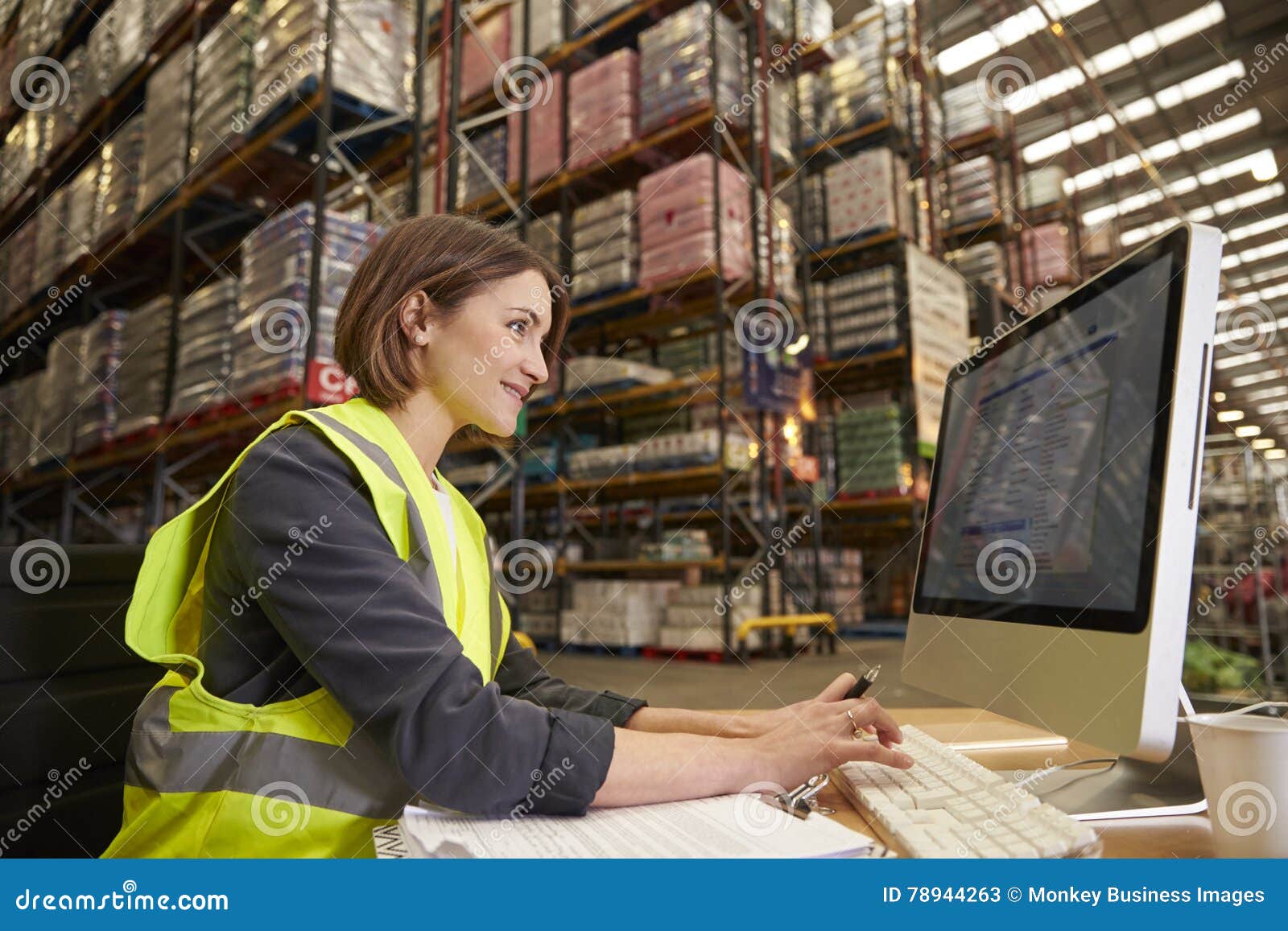 Woman Working at Computer in on-site Office of a Warehouse Stock Image ...