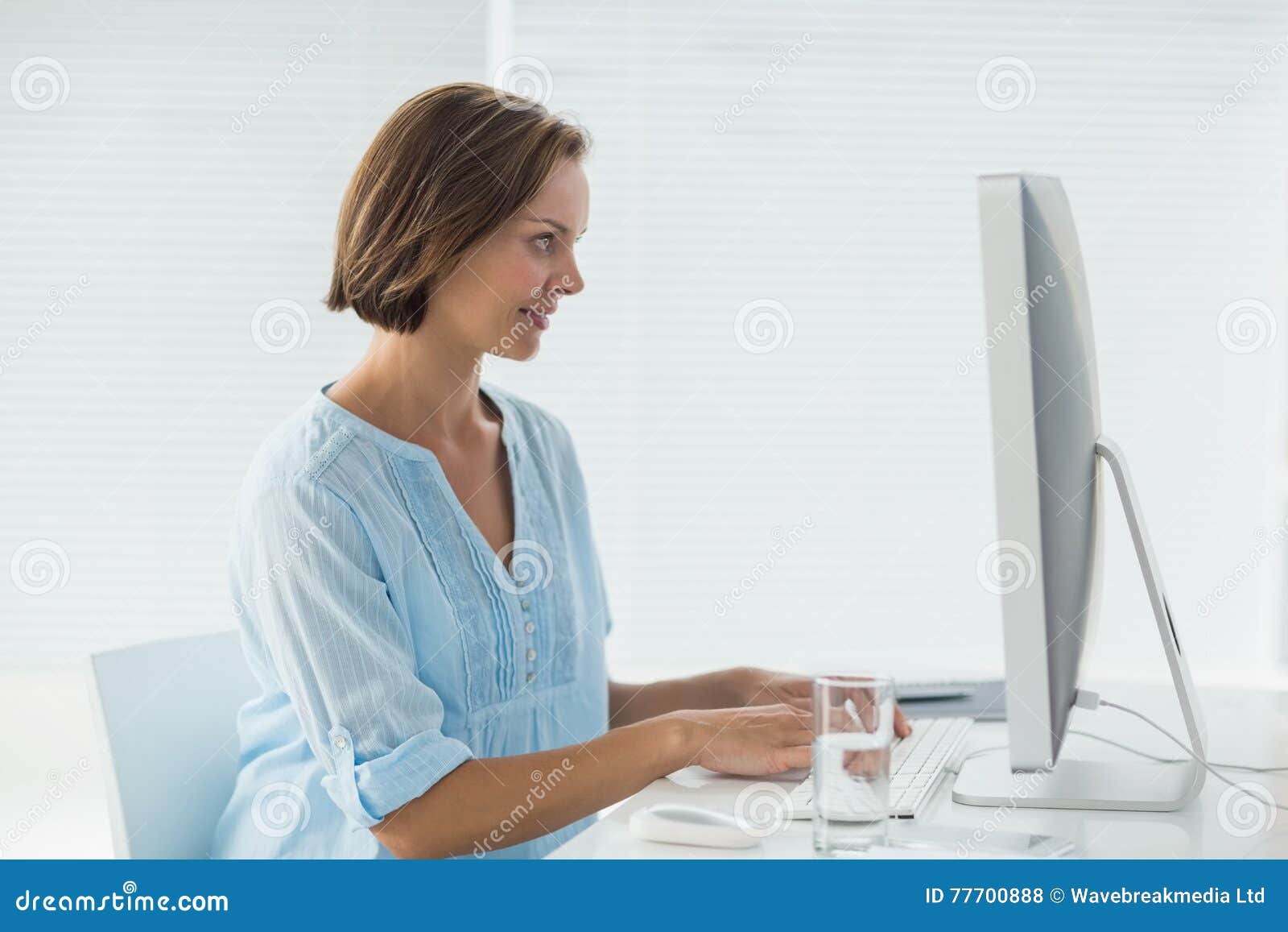 Woman working on computer stock photo. Image of pretty - 77700888