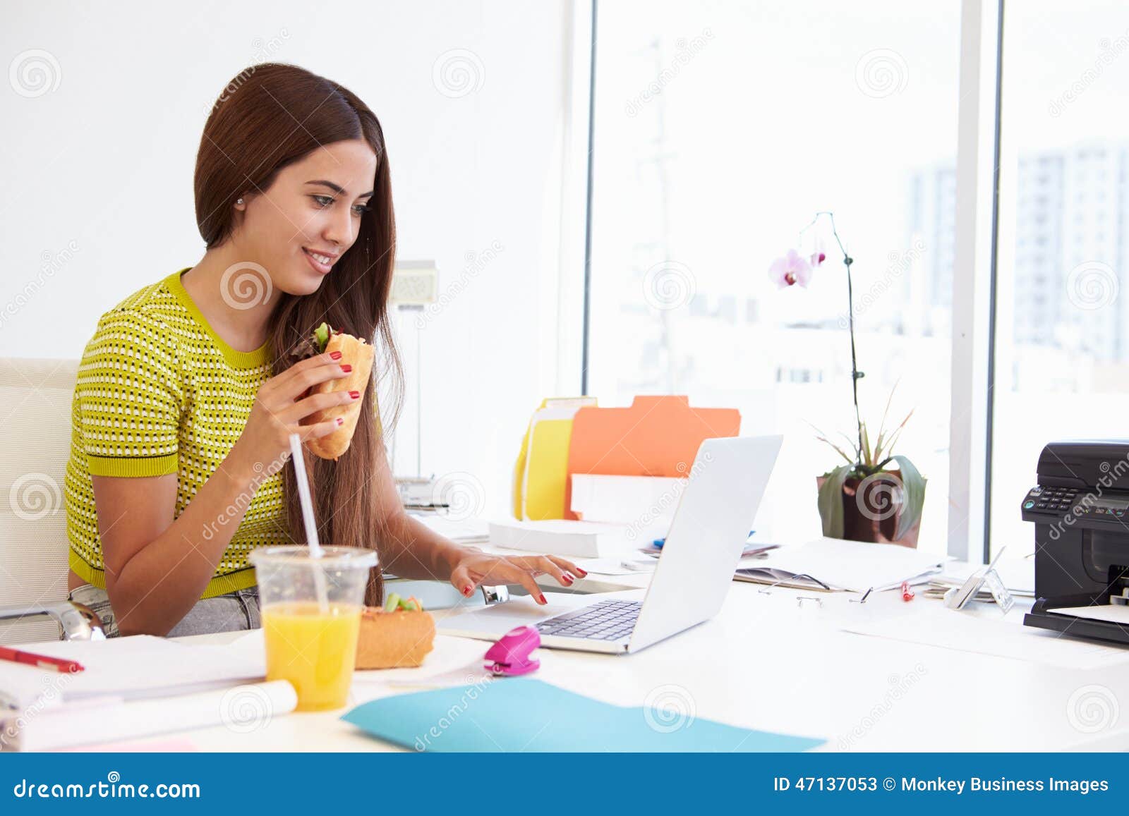Woman Working in Design Studio Having Lunch at Desk Stock Image - Image ...