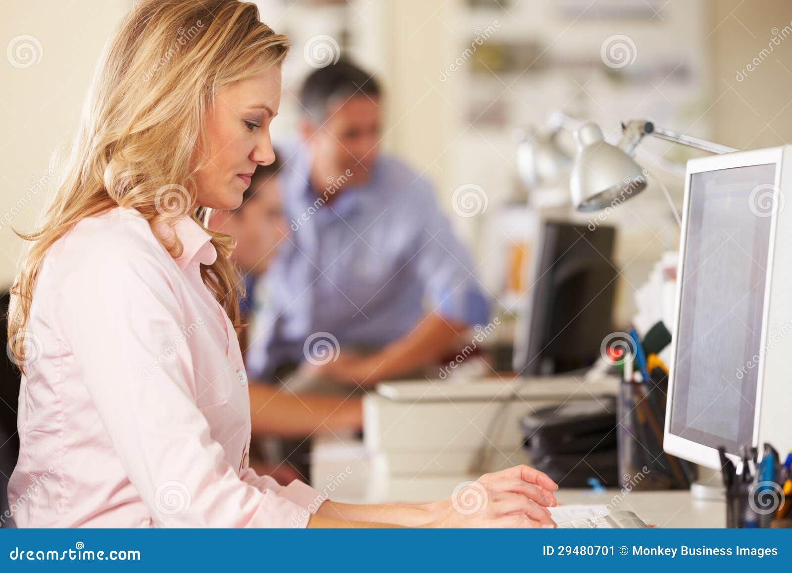 Woman Working at Desk in Busy Creative Office Stock Image - Image of ...