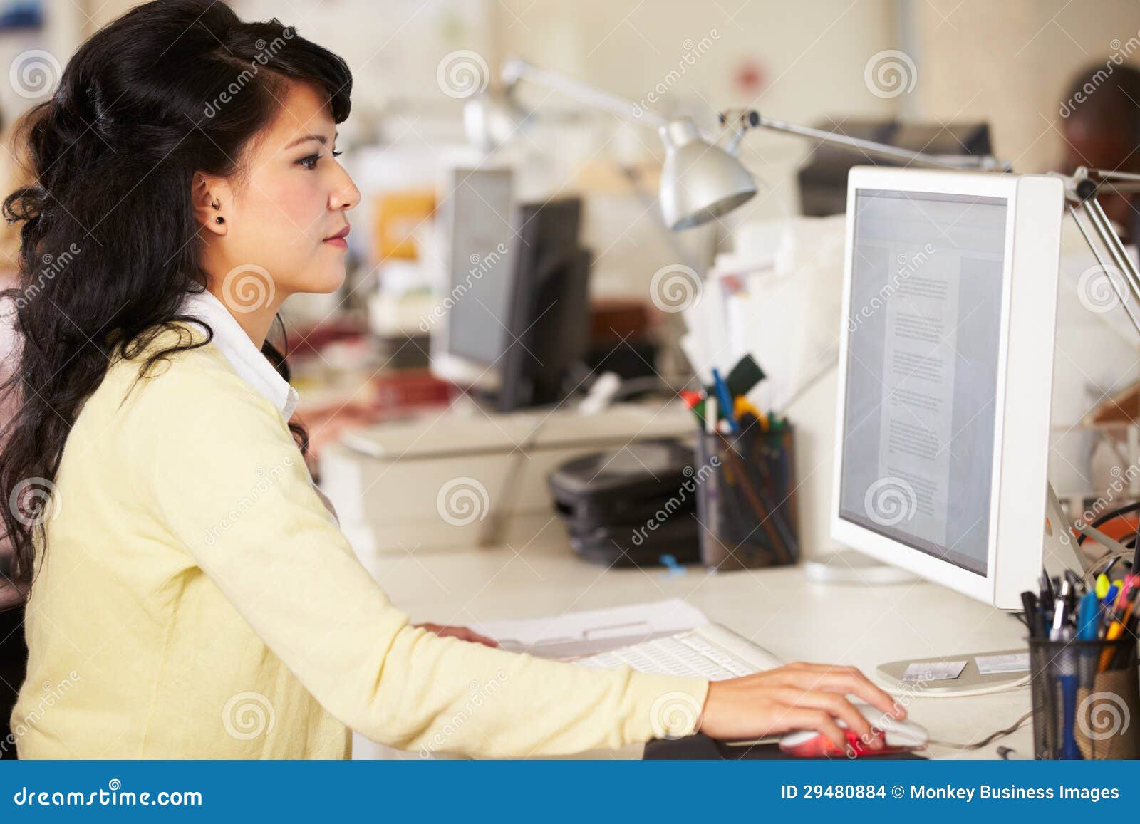 Woman Working at Desk in Busy Creative Office Stock Photo - Image of ...