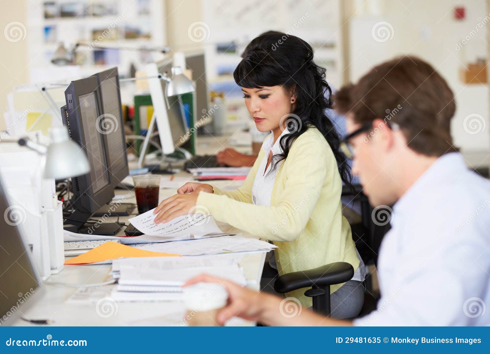 Woman Working at Desk in Busy Creative Office Stock Image - Image of ...