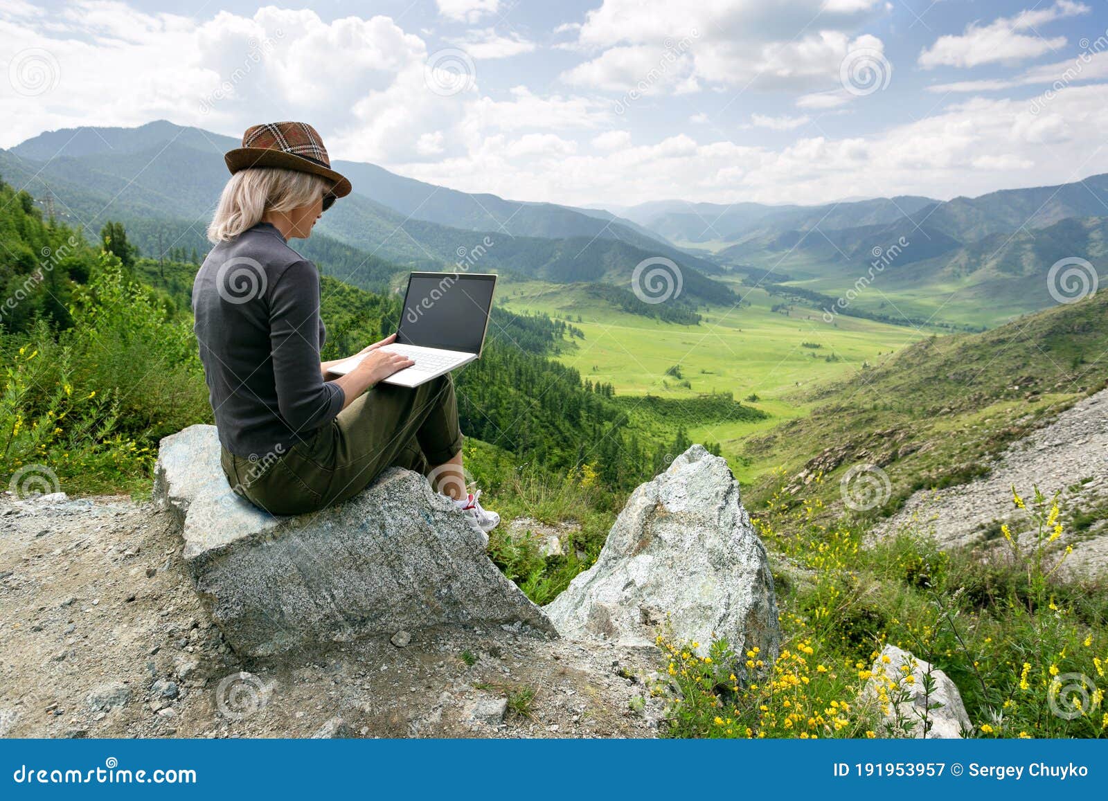 Woman Working on Her Computer on the Top of the Mountain. Remote Work ...