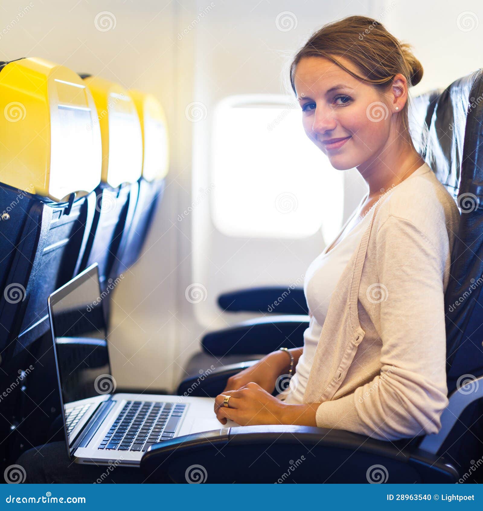 Woman Working on Her Laptop Computer on Board of an Airplane Stock ...
