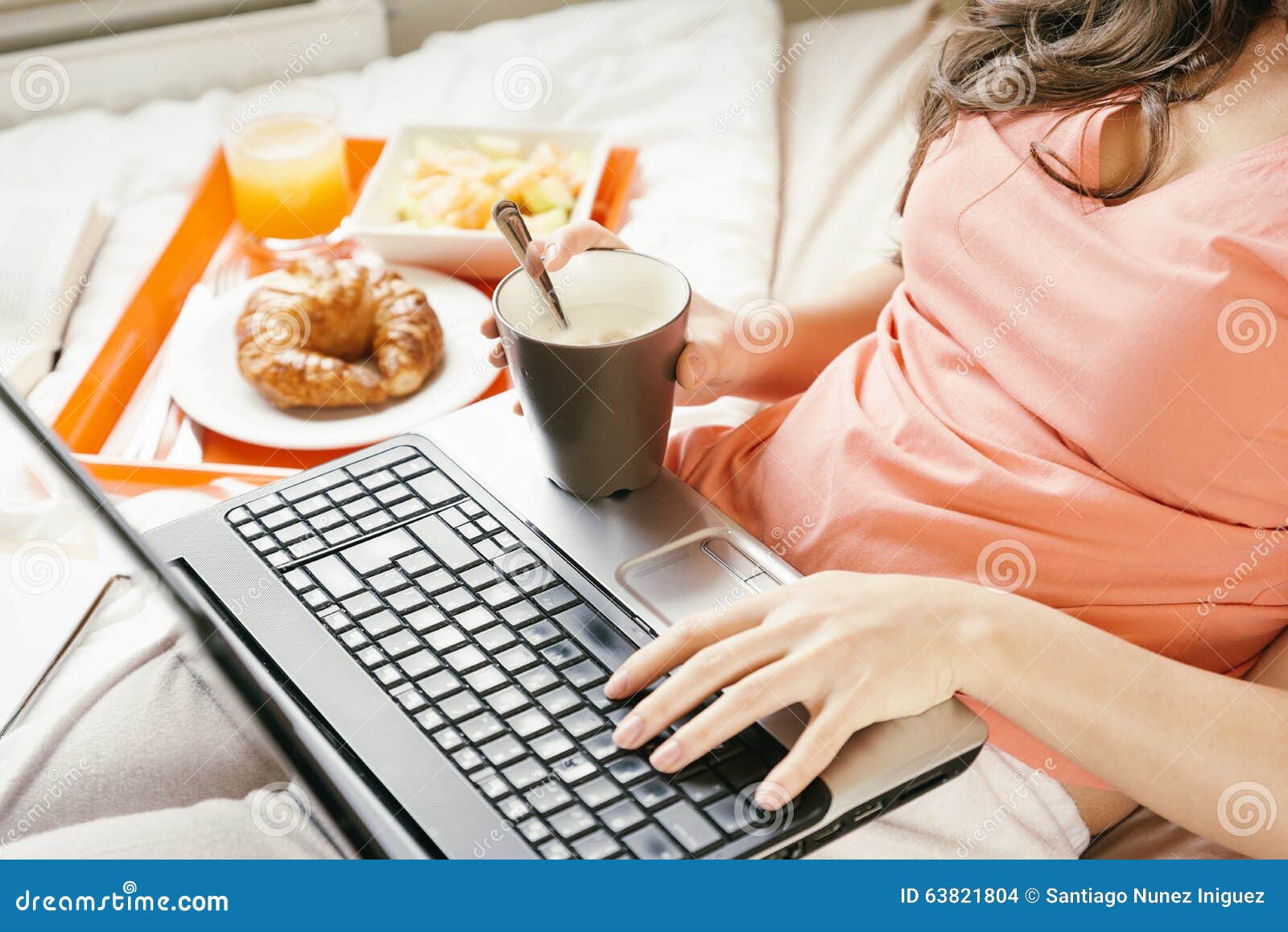 Woman Working with Her Laptop Computer and Having Breakfast Stock Photo ...