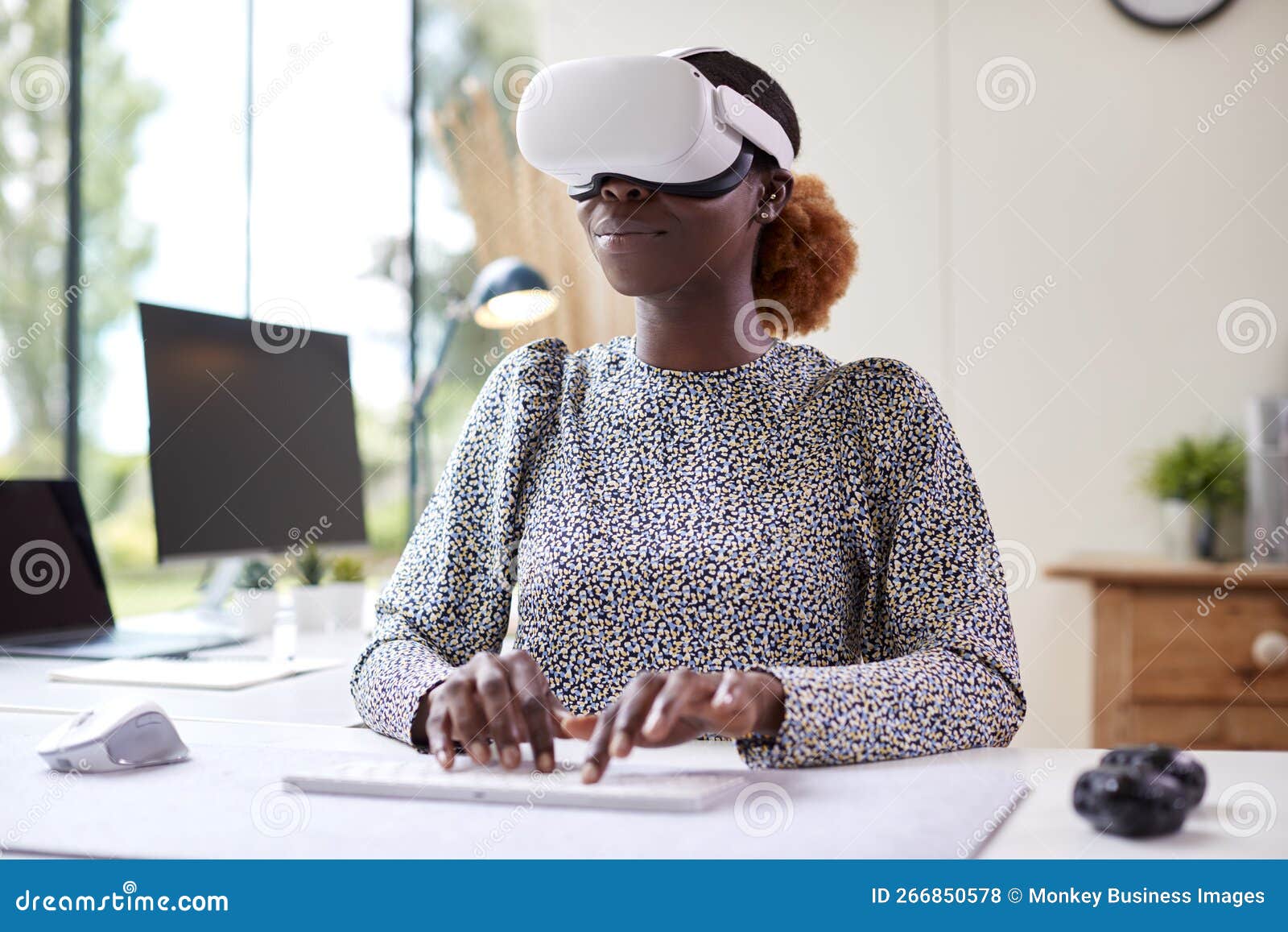 Woman Working from Home Office Sitting at Desk Wearing VR Headset Using ...