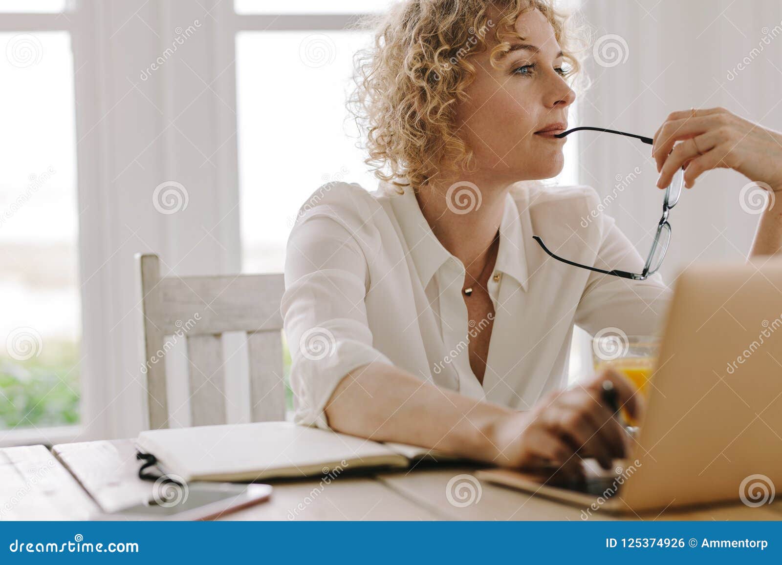 Woman working from home stock photo. Image of indoors - 125374926