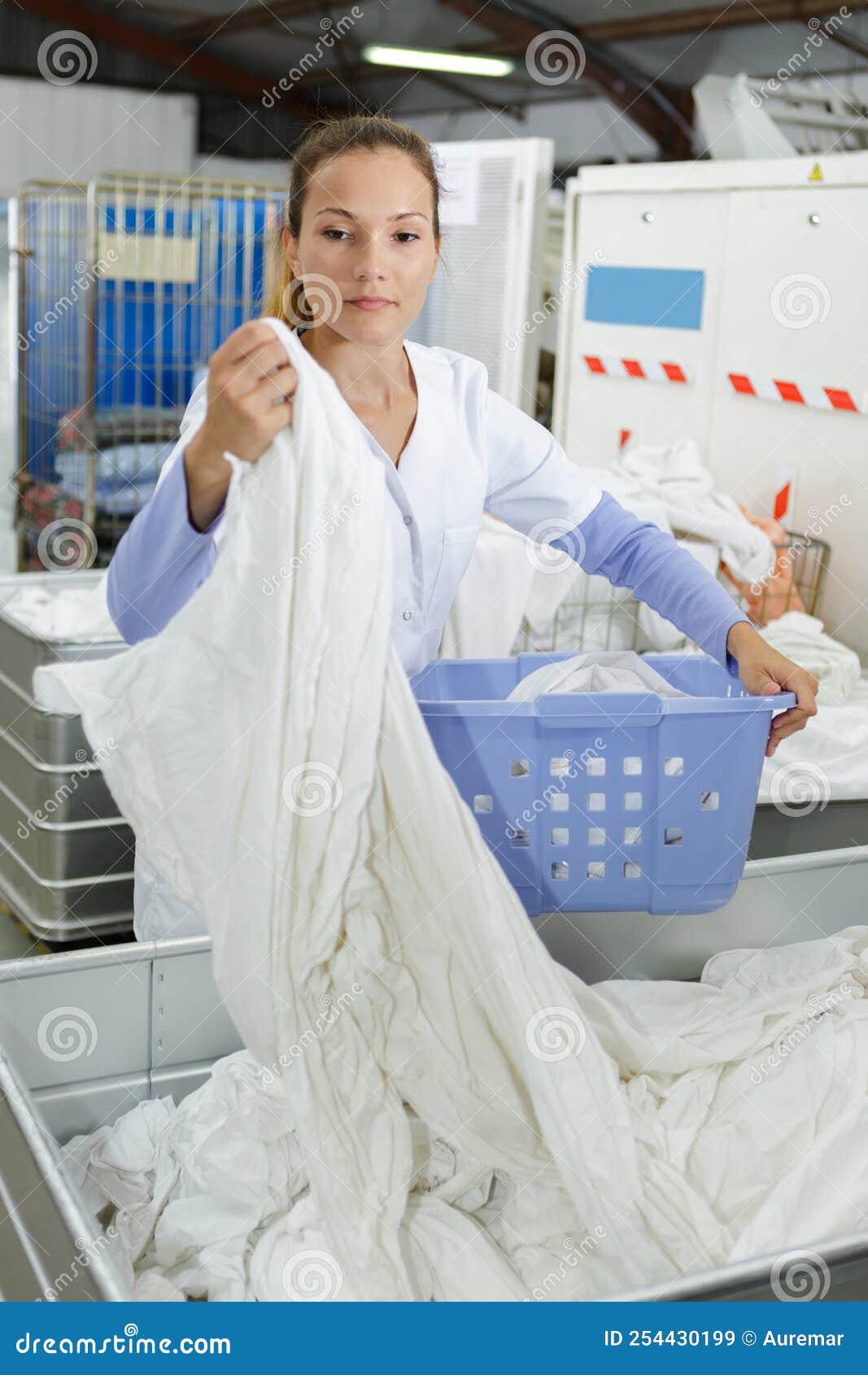 Woman working at laundry stock image. Image of equipment - 254430199