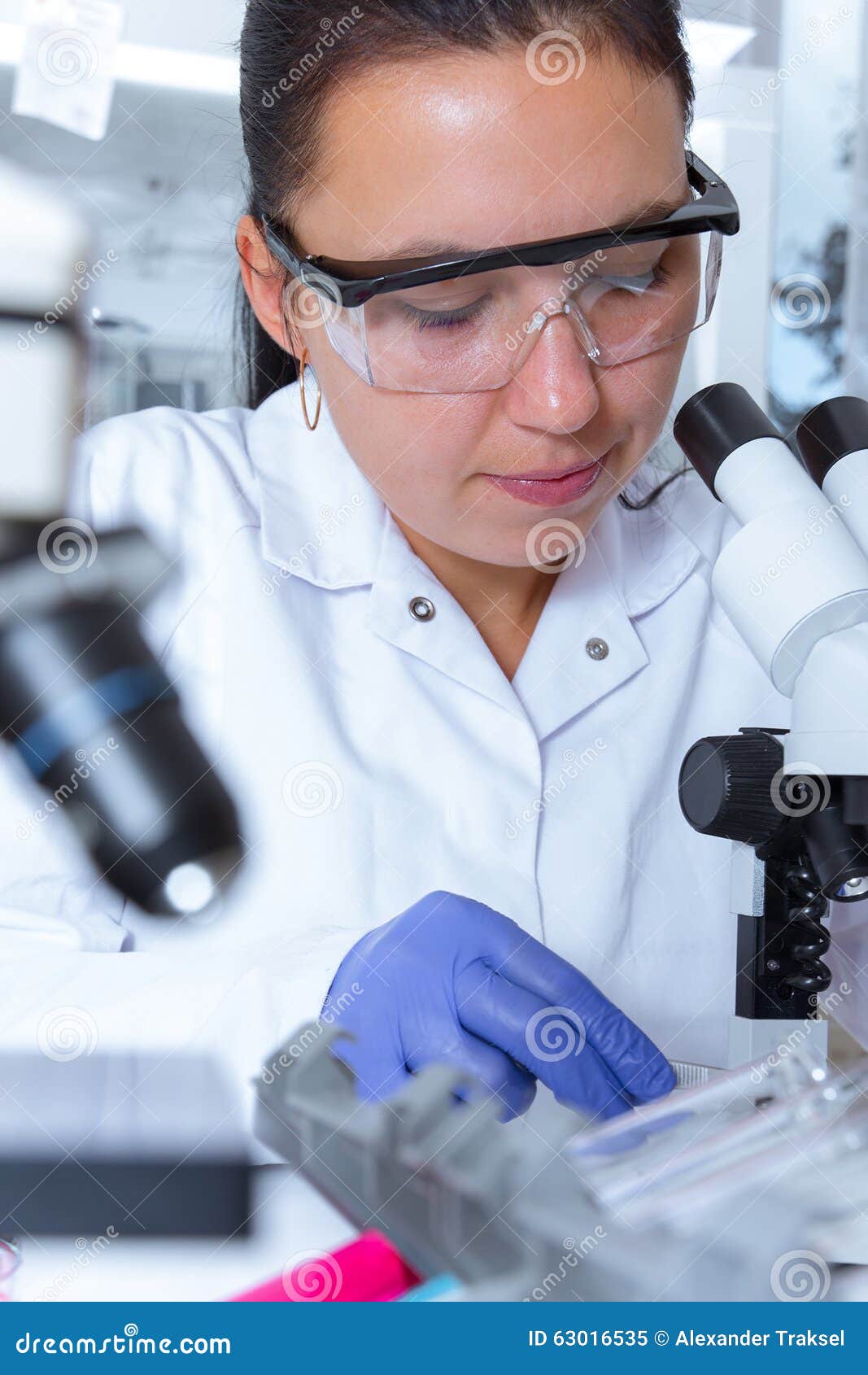 Woman Working with a Microscope in a Lab Stock Image - Image of ...