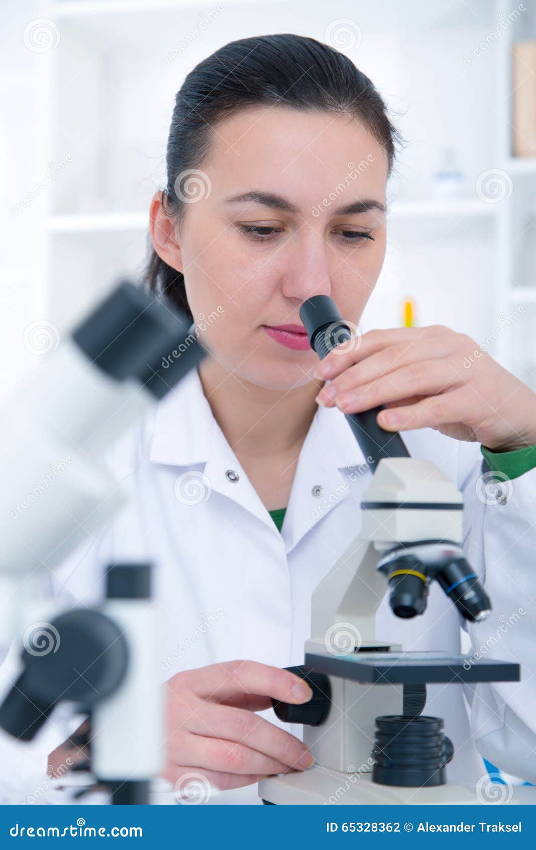 Woman Working with a Microscope in a Lab.Toning Image Stock Photo ...