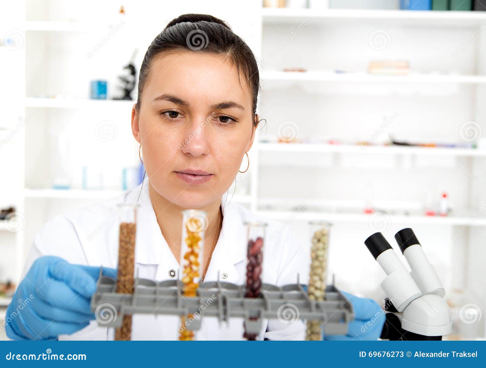 Woman Working with a Microscope in a Lab. Stock Image - Image of adult ...