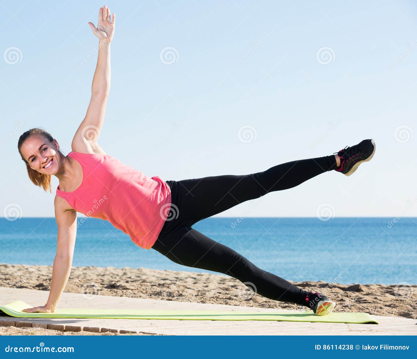 Woman working out in beach stock photo. Image of beach - 86114238