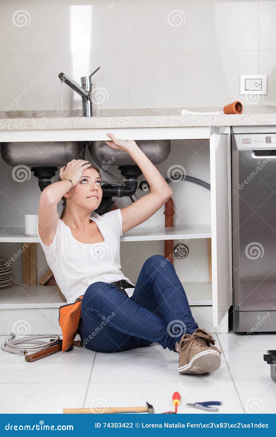 Woman Working in the Pipe of the Kitchen Stock Photo - Image of face ...