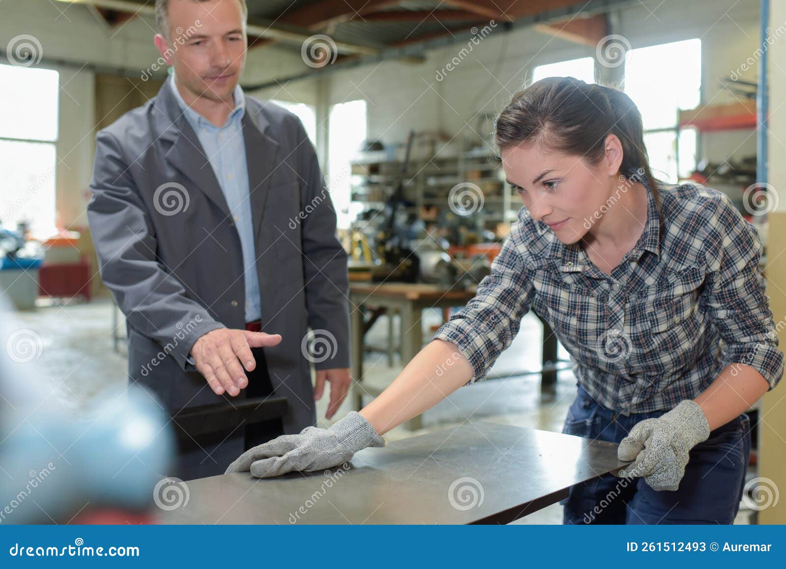 Woman Working with Sheet Metal Under Supervision Stock Image - Image of ...