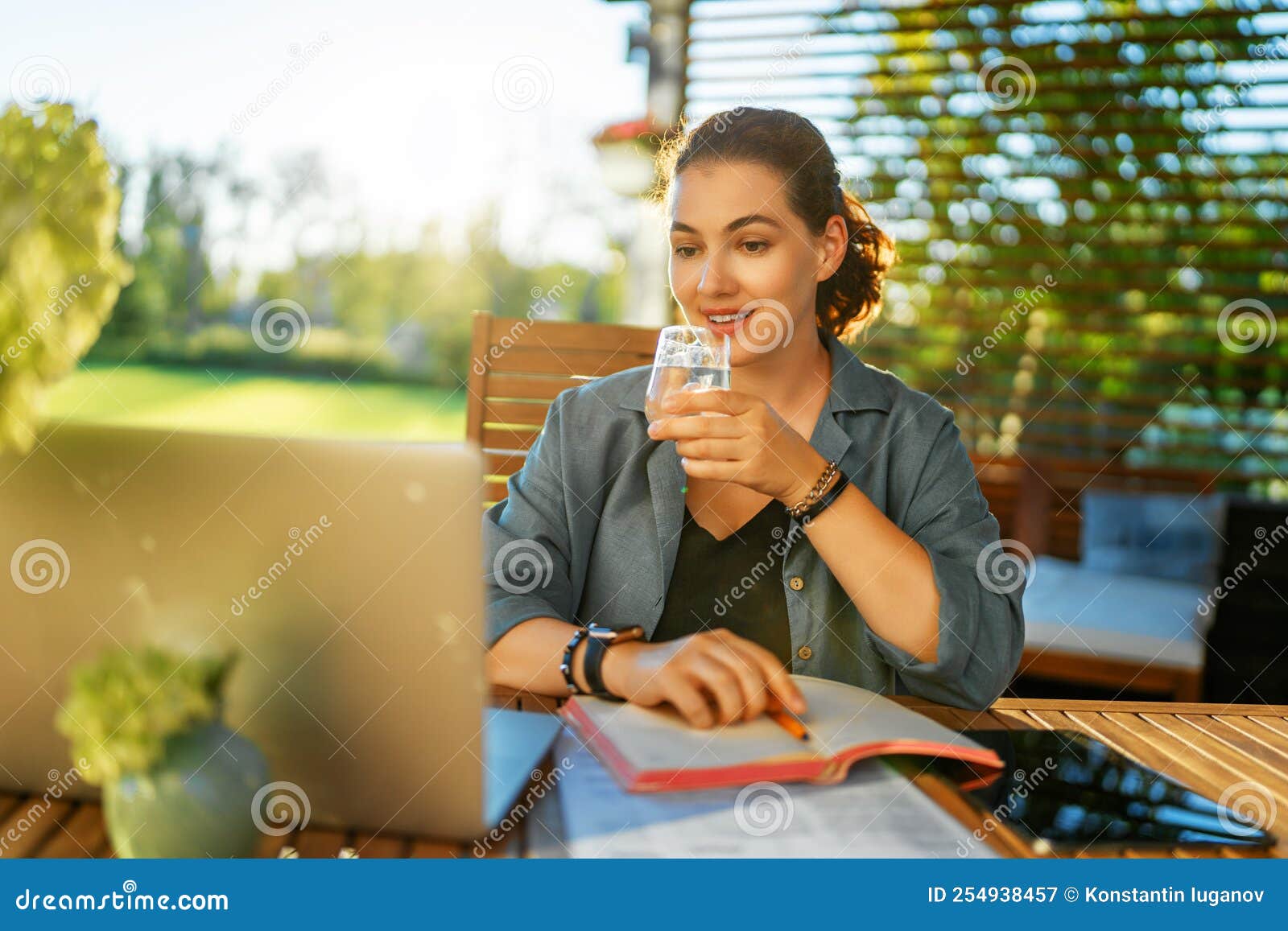 Woman is Working Sitting on the Patio Stock Image - Image of notebook ...