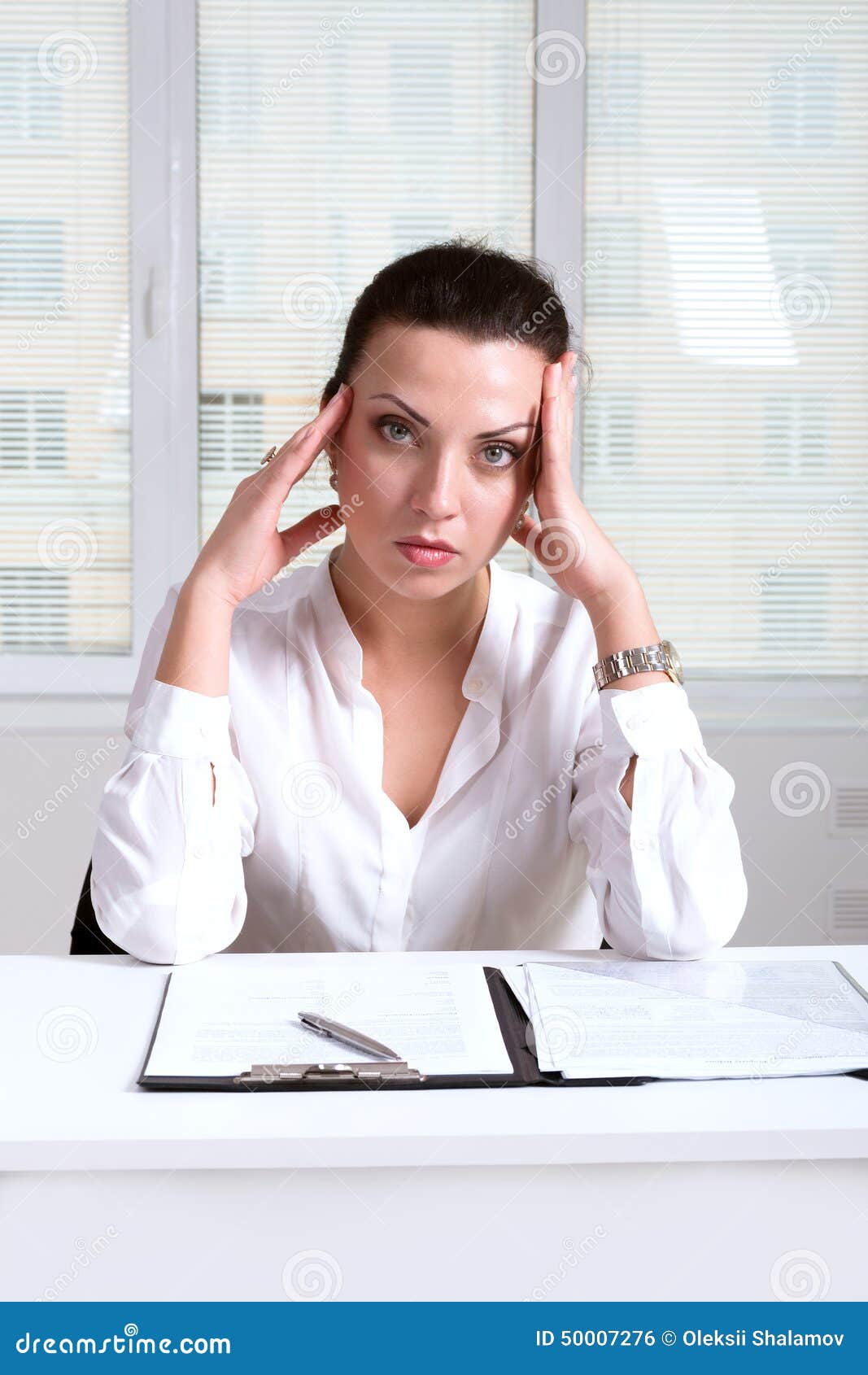 Woman on the Workplace Head Touches Her Hands because she Had a Stock ...