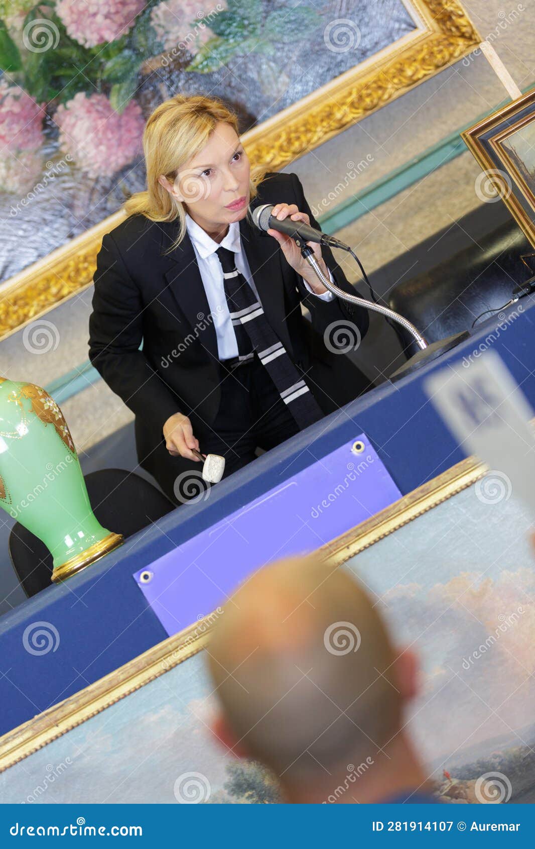 Woman works at auction stock image. Image of cheer, merchandise - 281914107