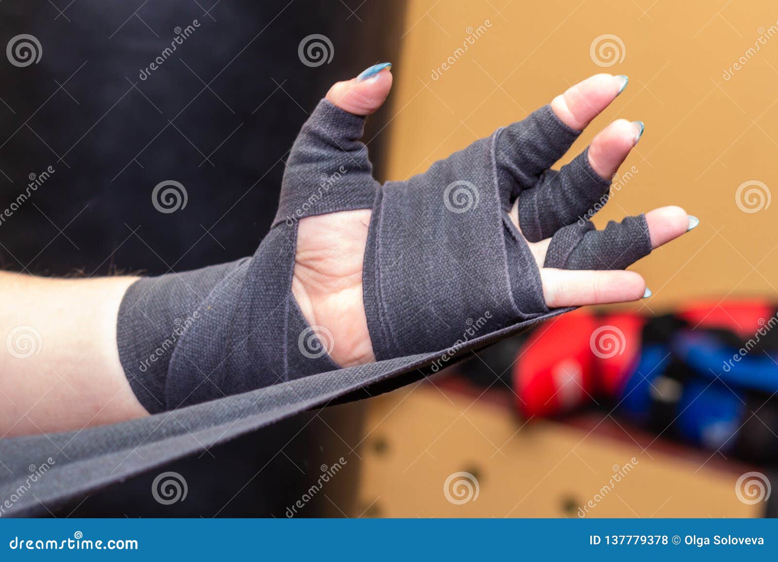 Woman is Wrapping Hands with Grey Boxing Wraps. Closeup Stock Photo ...
