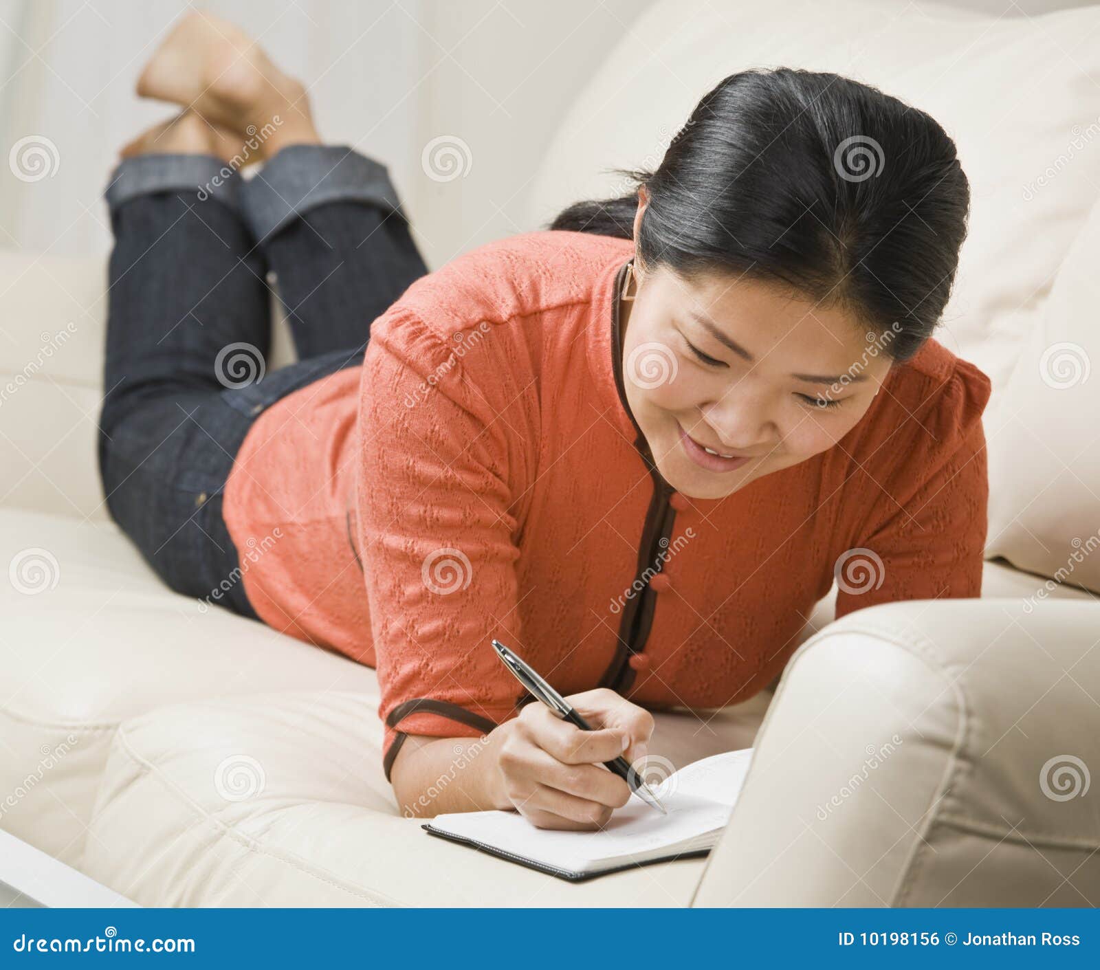 Woman Writing in Book stock photo. Image of house, apartment - 10198156