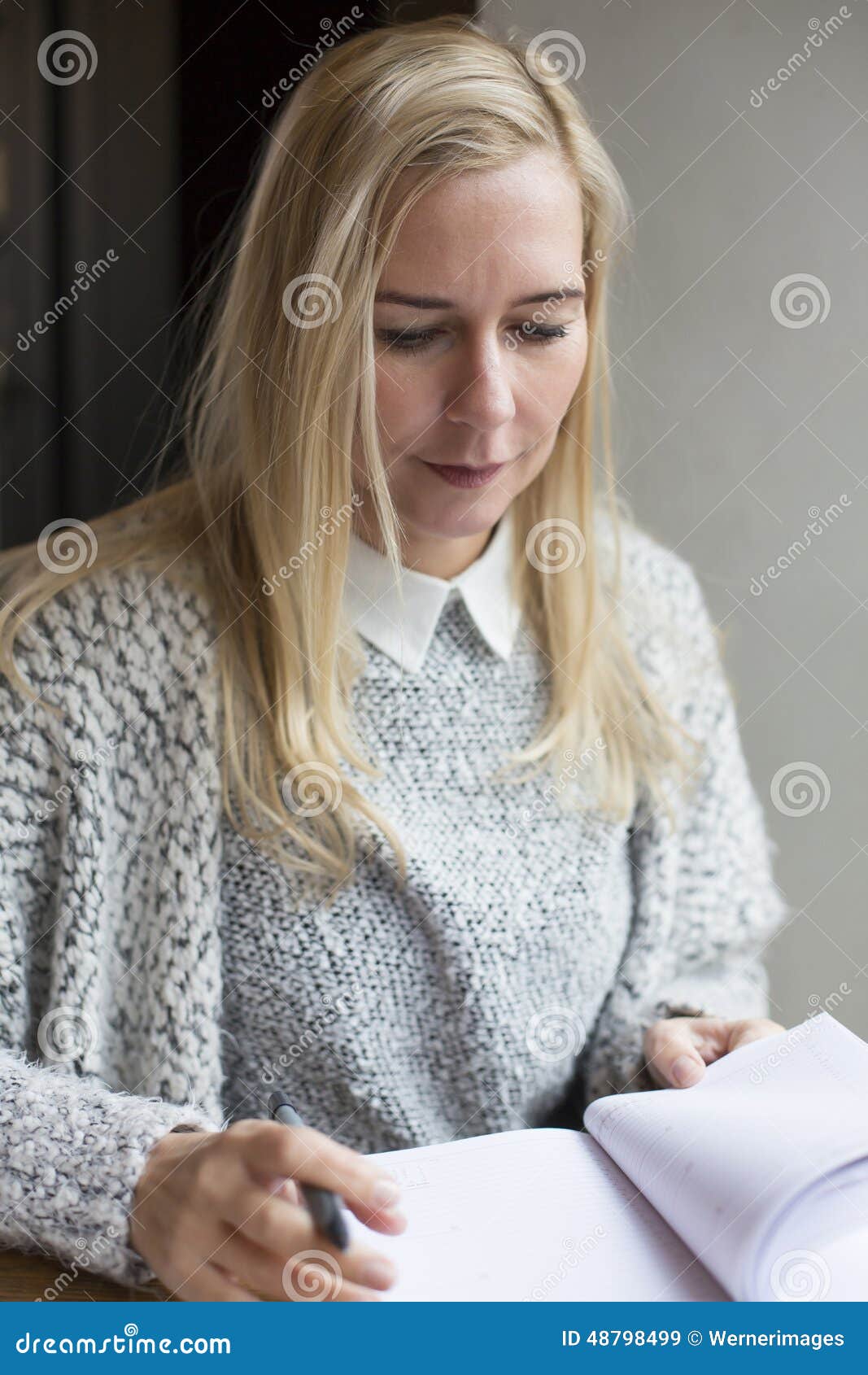 Woman writing in a book stock image. Image of notebook - 48798499