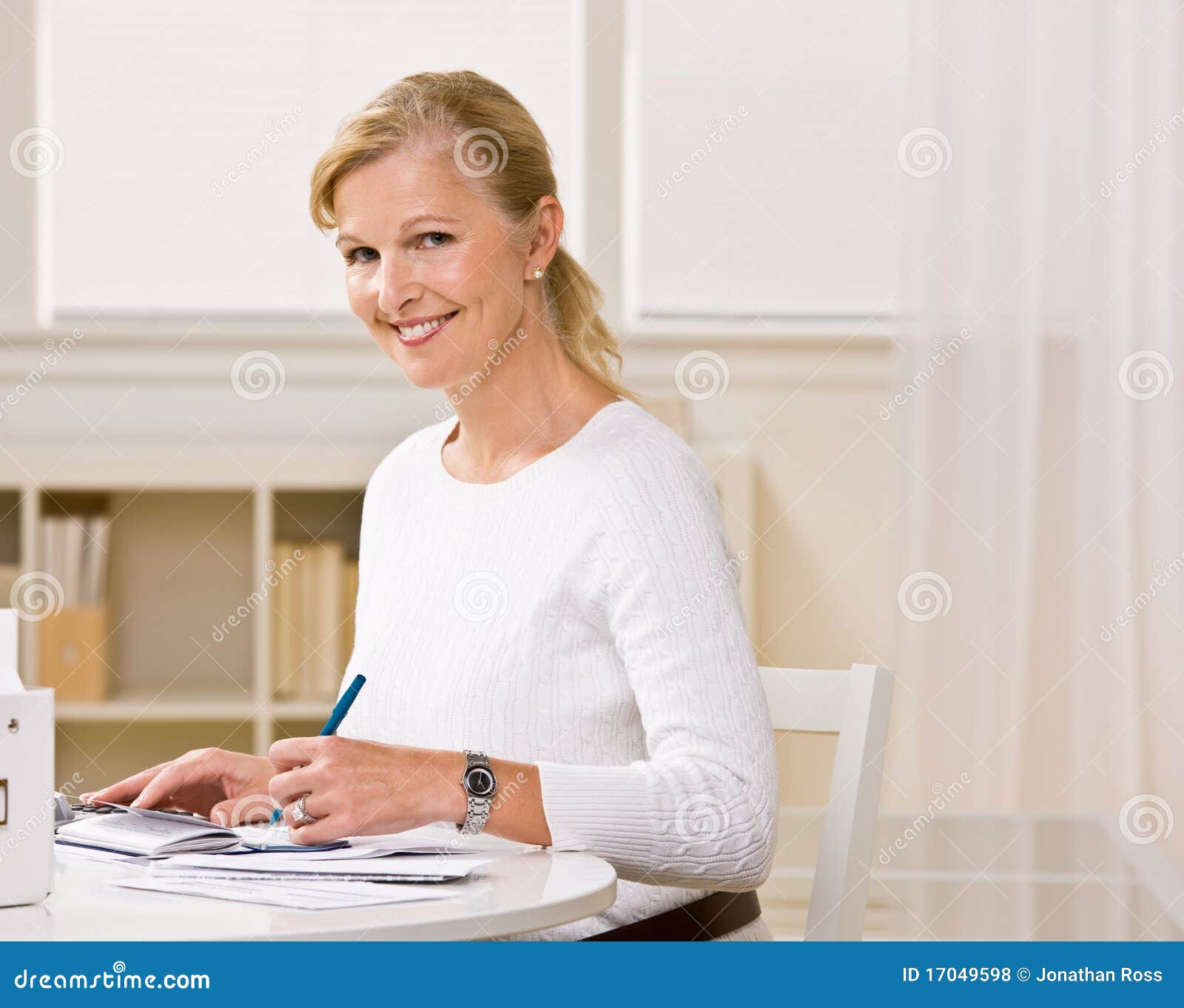 Woman writing checks stock photo. Image of check, adult - 17049598